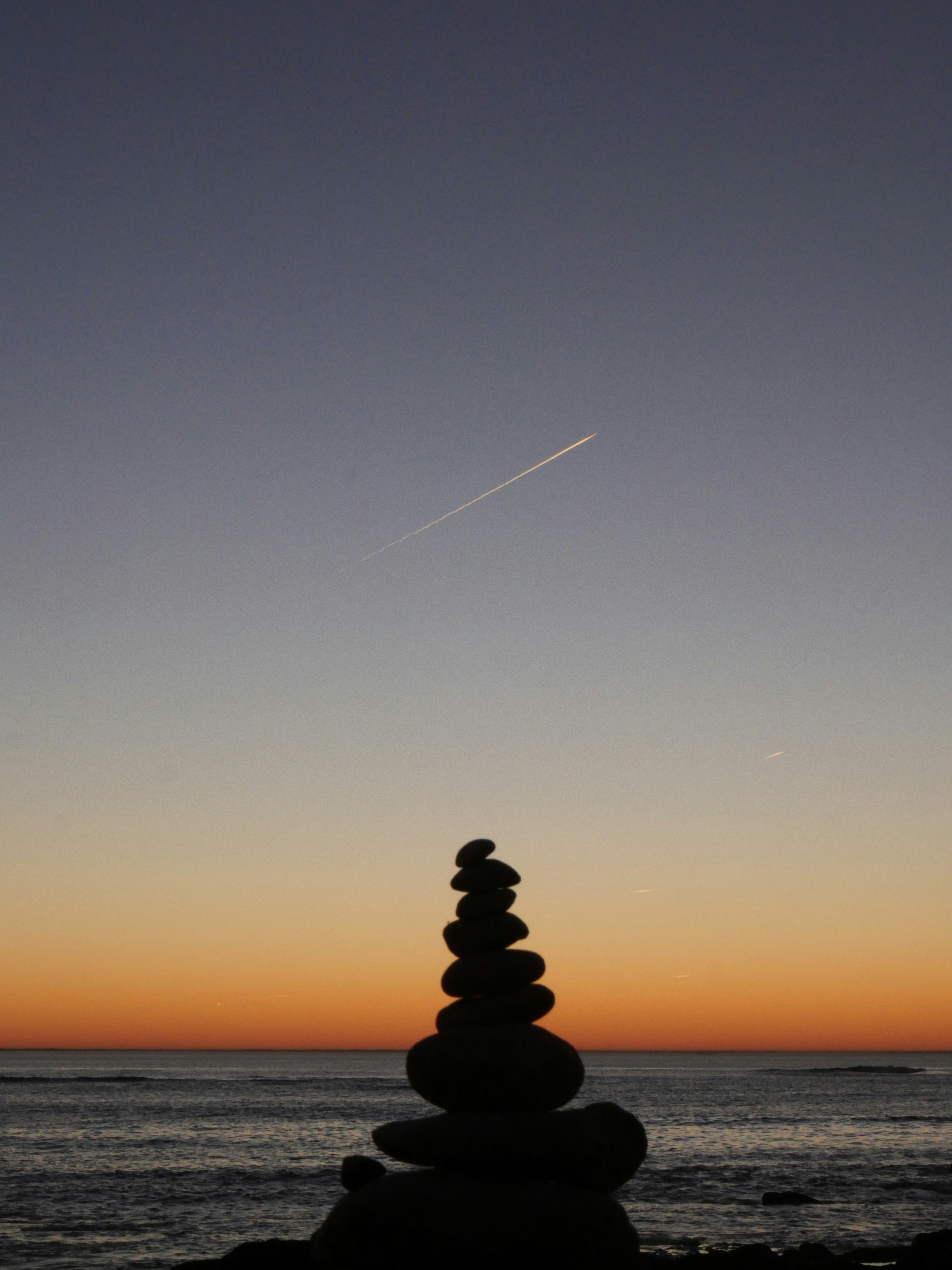 A stack of rocks sitting on top of a beach photo – Free La rochelle ...