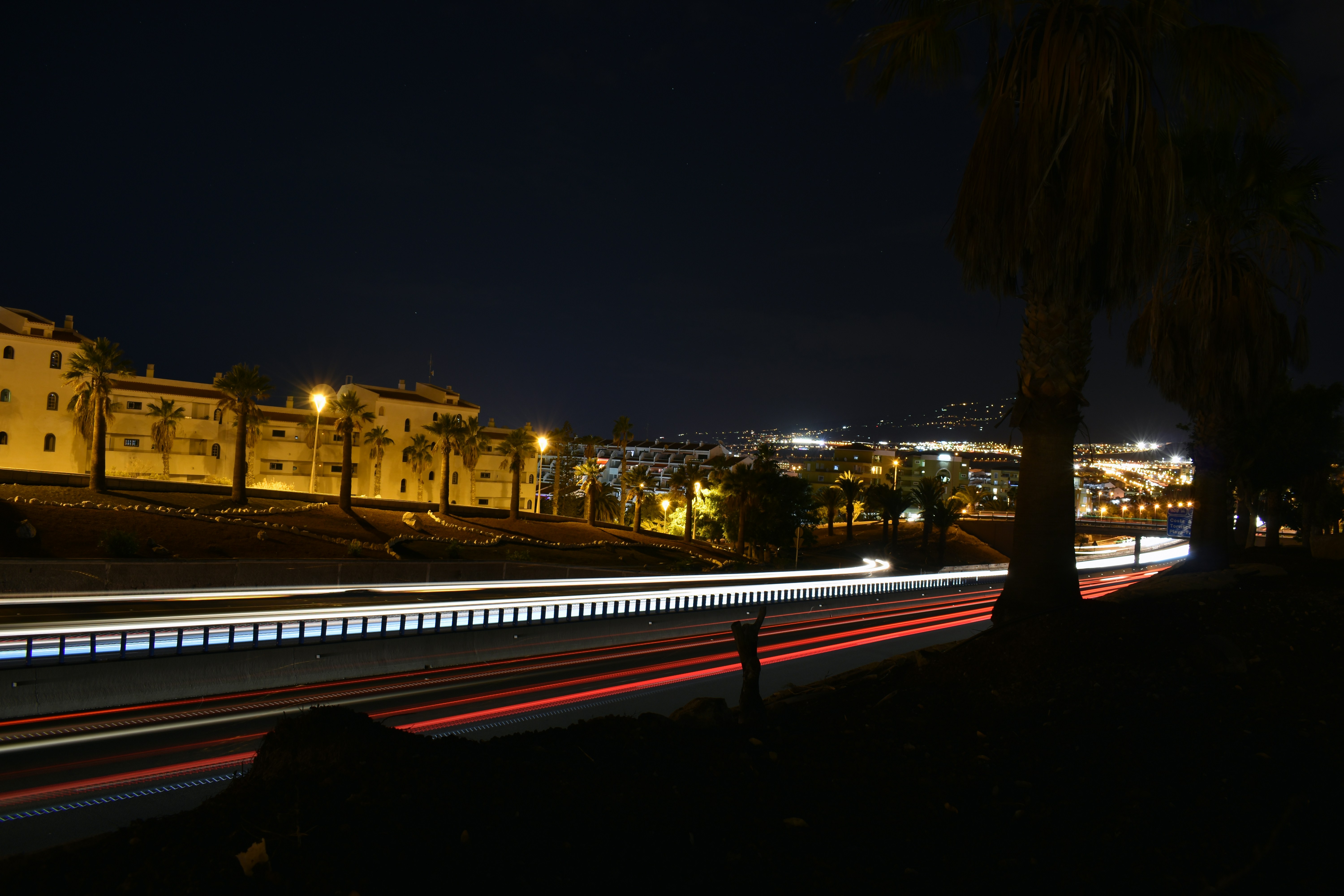 a long exposure photo of a city at night