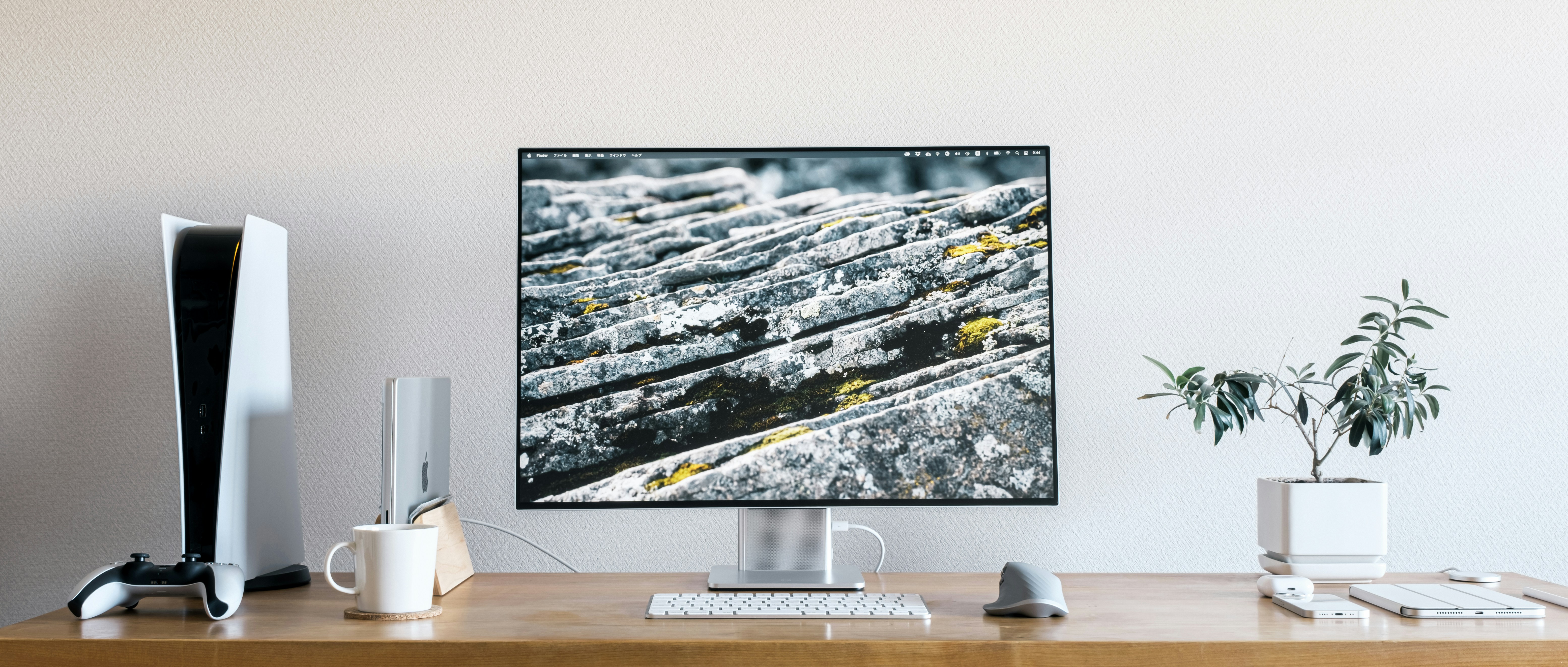 a computer monitor sitting on top of a wooden desk
