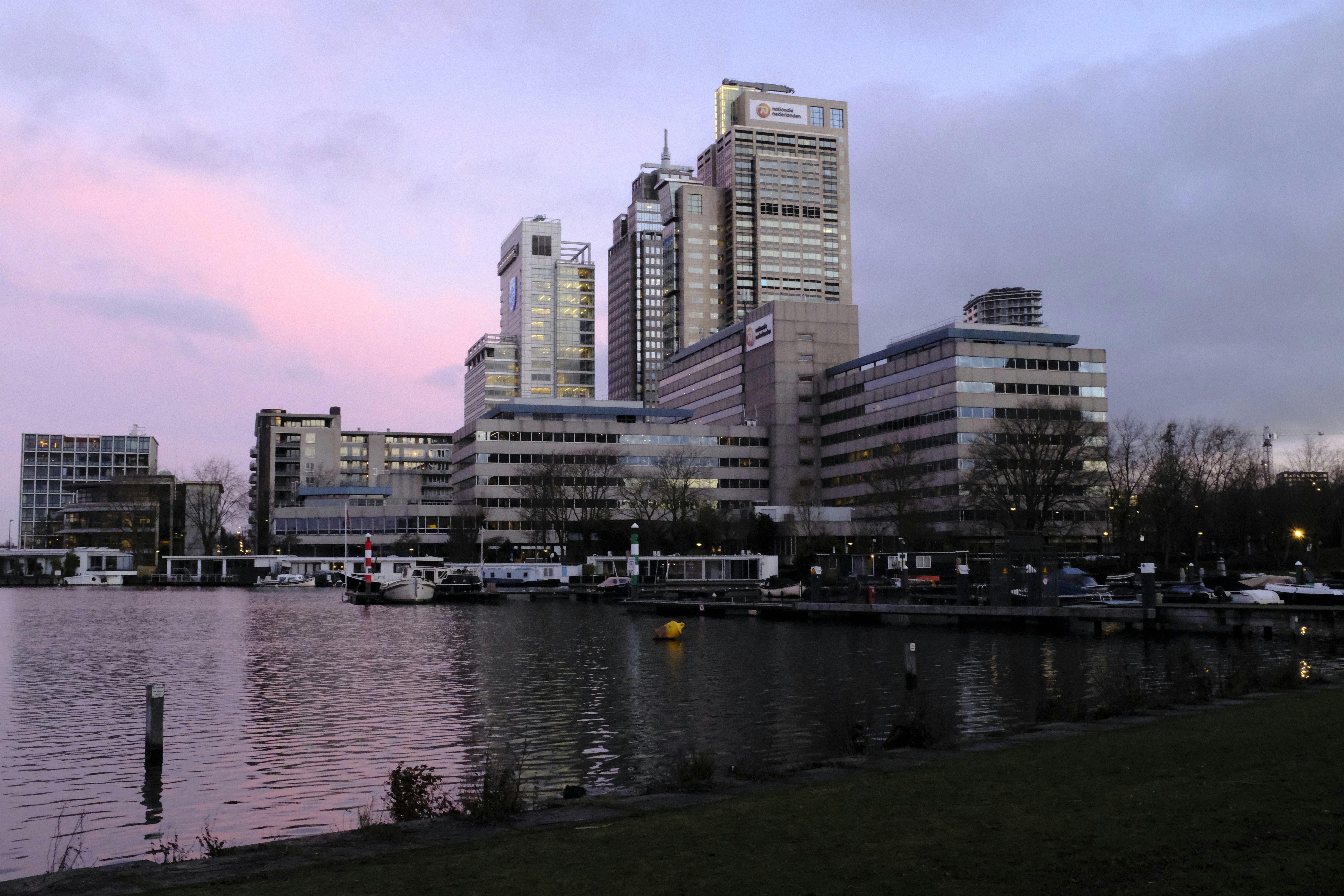 Pink Hour Over Glass Towers by the Tranquil Marina