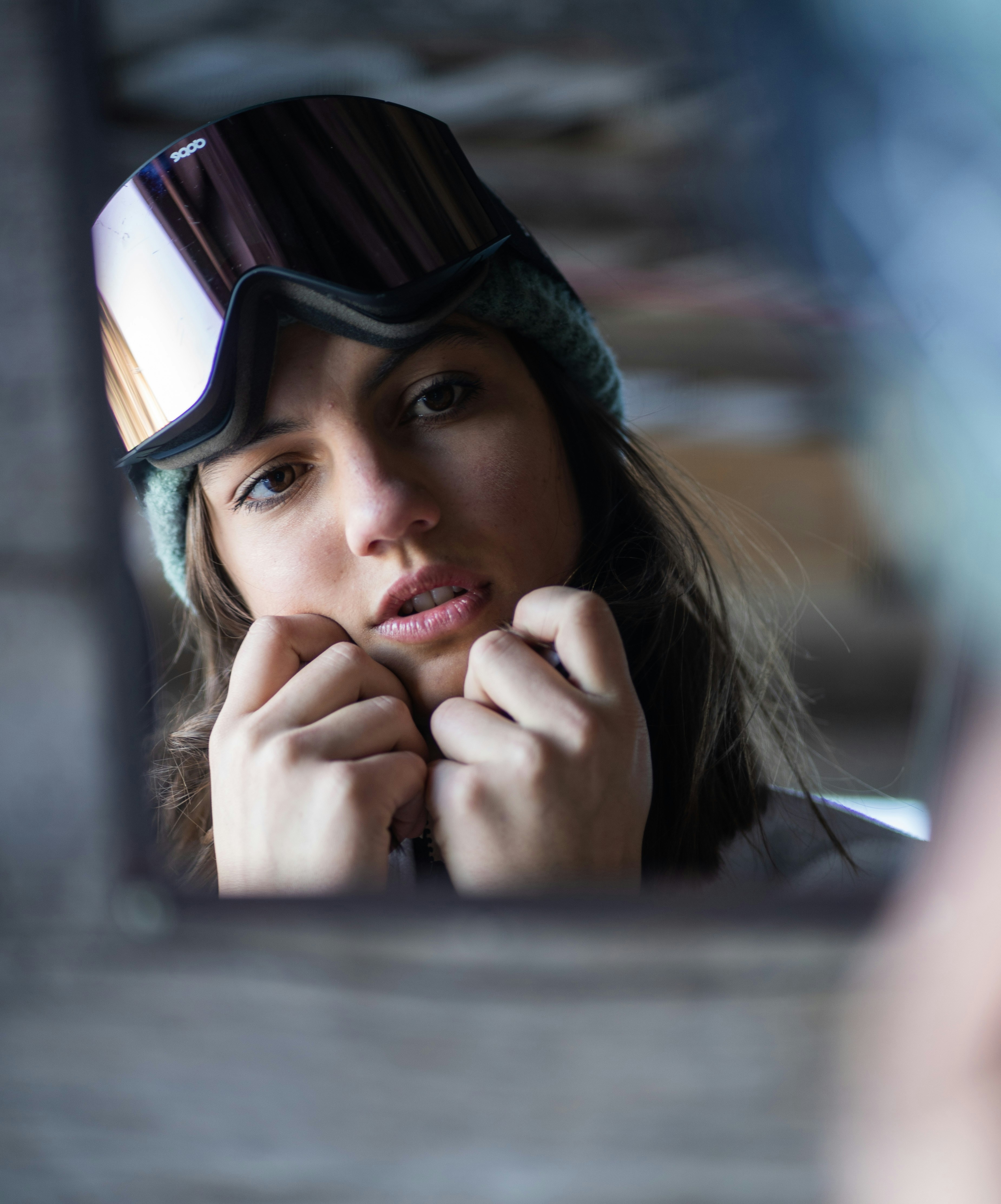 Goggle-Glimmer: A Quiet Portrait in a Framed Reflection