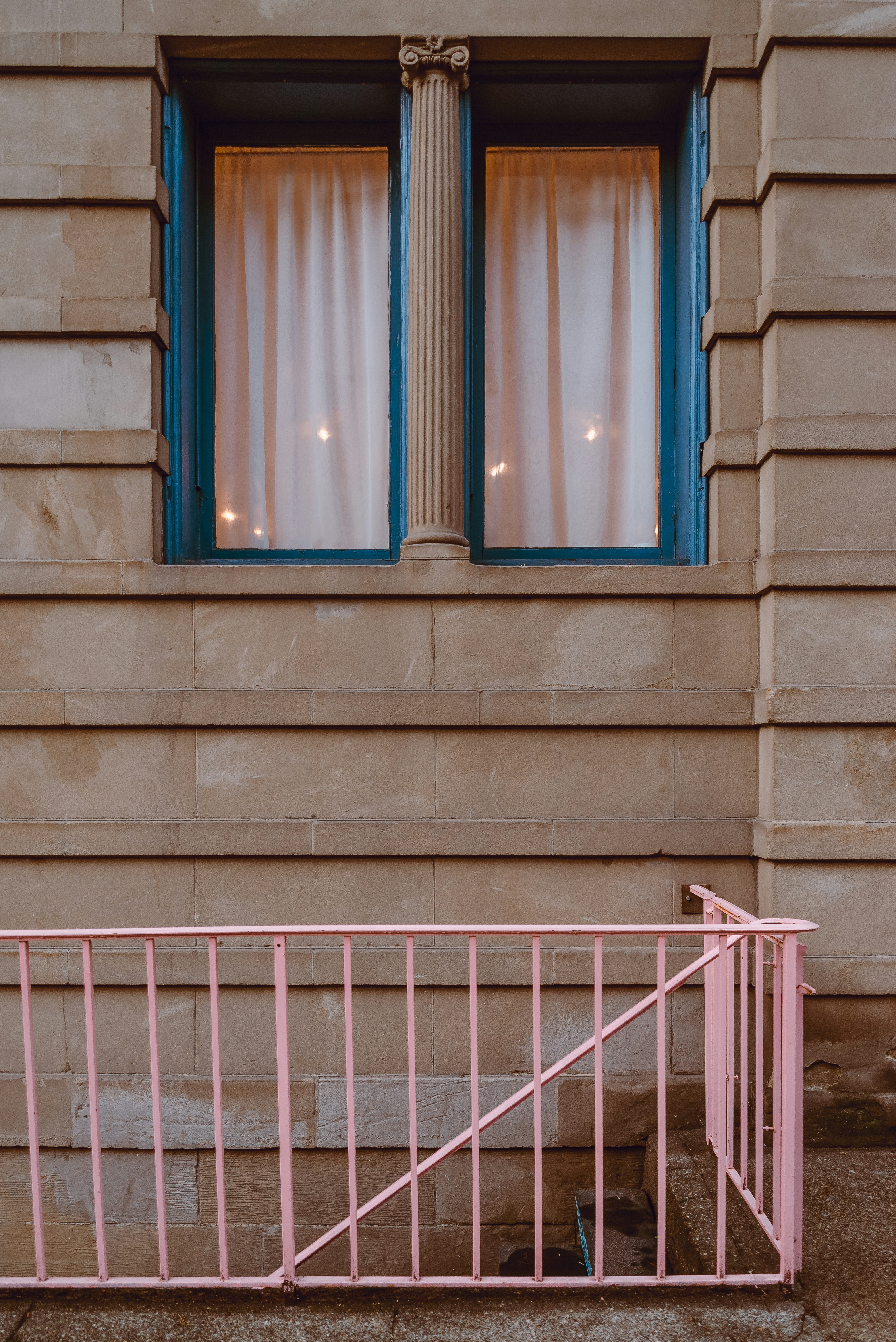 A pink gate sitting in front of a window photo – Free Railing Image on ...
