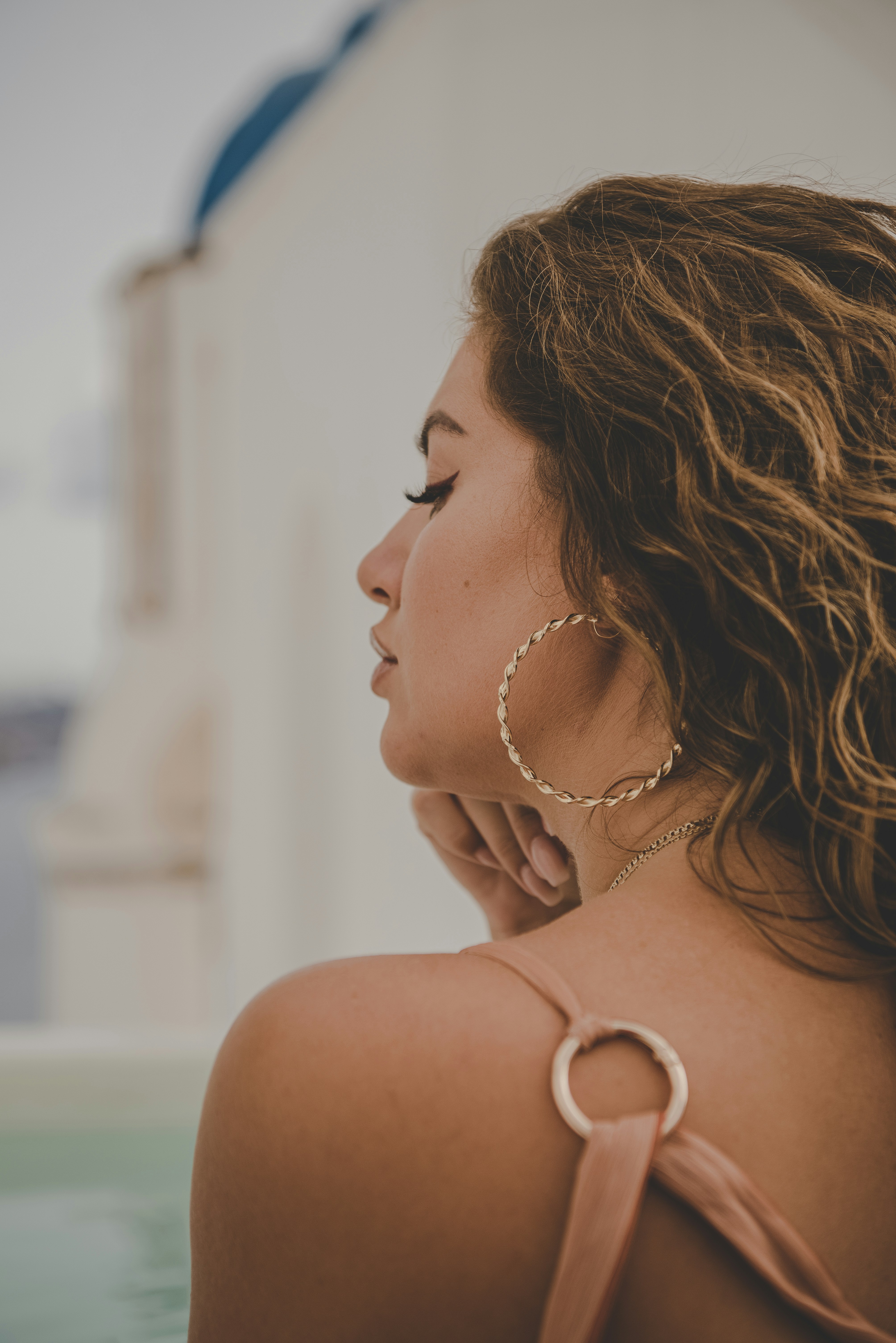 Poolside Profile in Warm Light: A Hoop Earring Moment