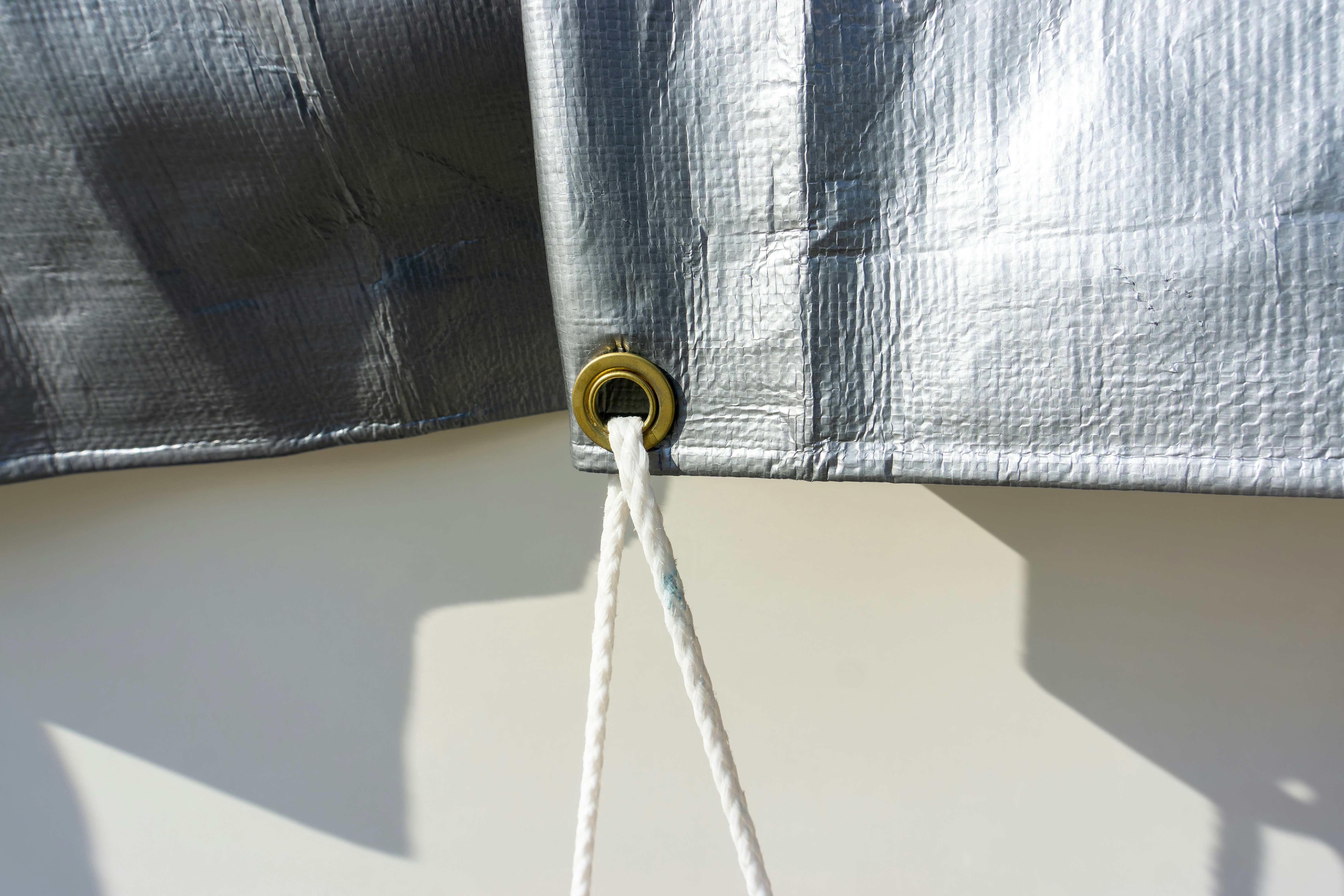 Brass Ring Geometry: Rope Through Silver Fabric