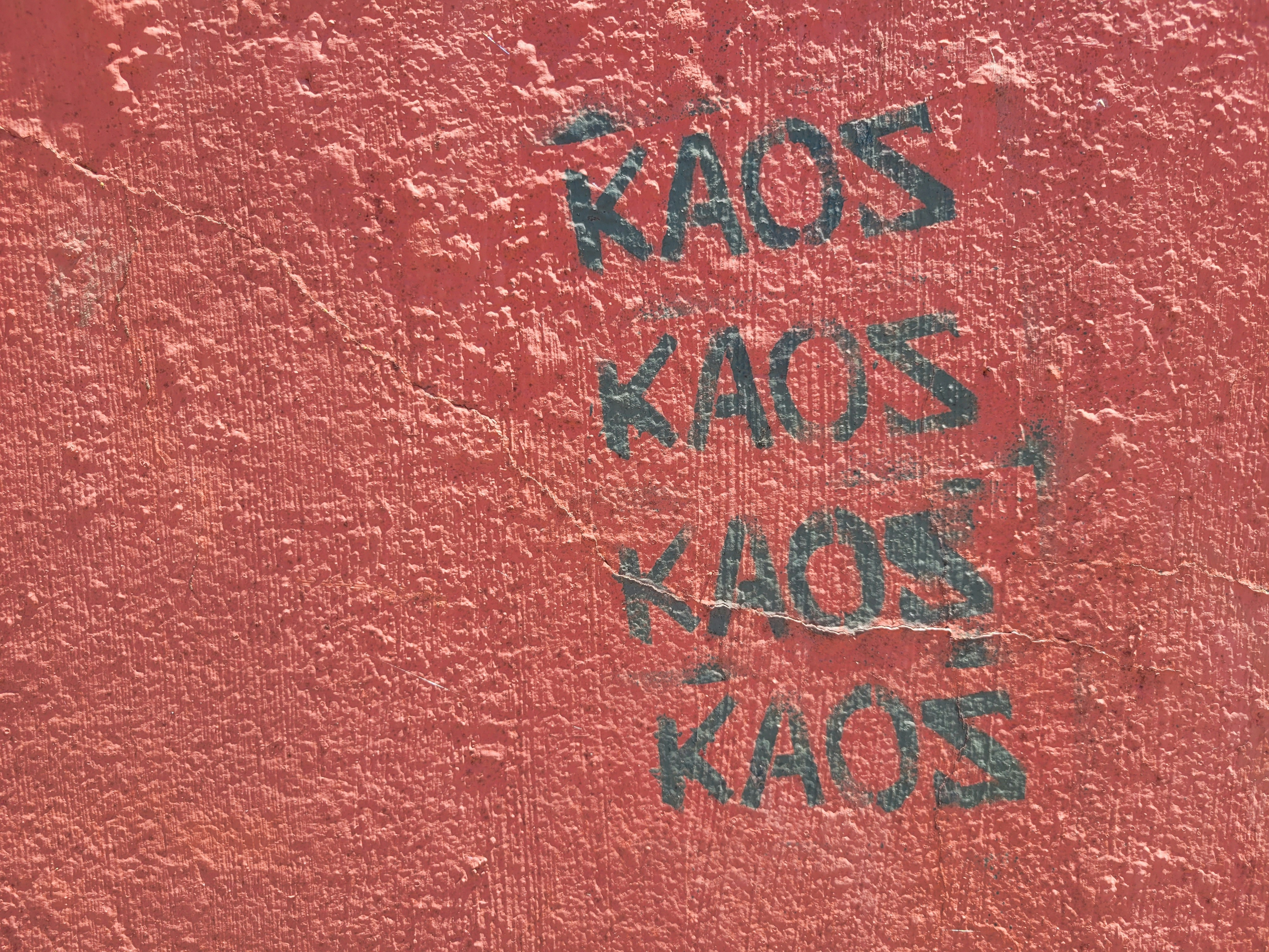 A red wall with graffiti written on it photo – Free Chillán Image on ...