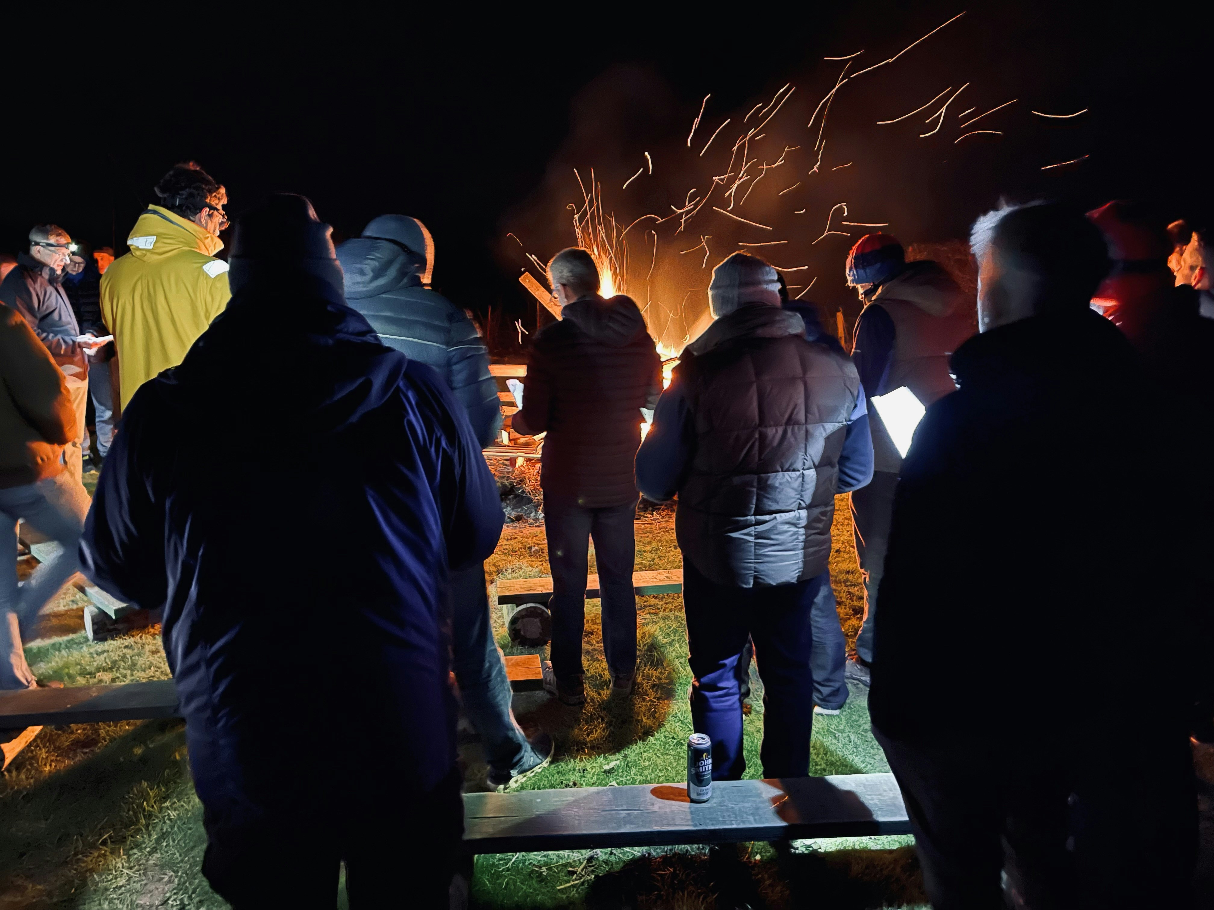 Ember Circle: Nighttime Gathering Around a Bonfire