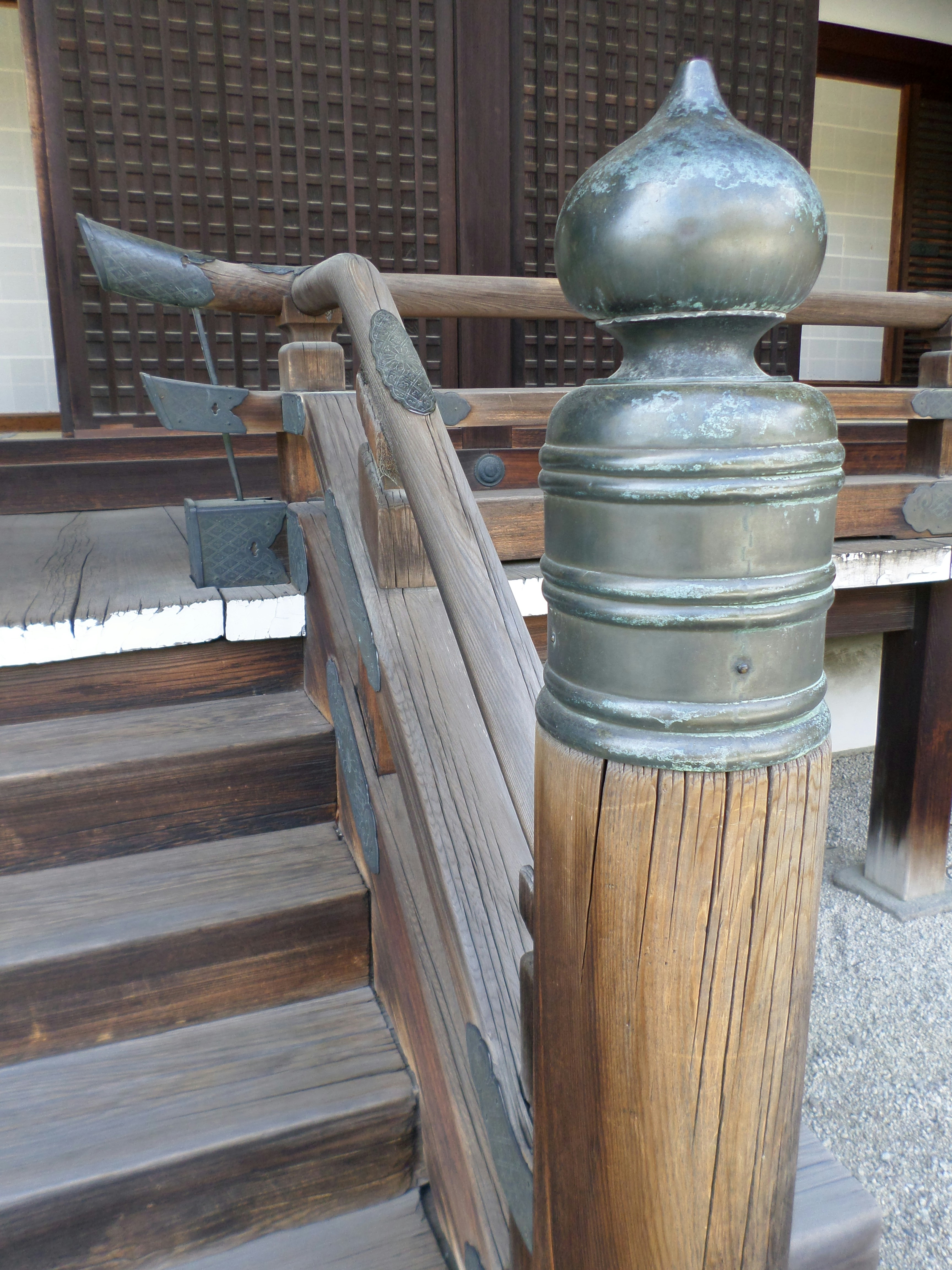 A close up of a wooden railing with a metal top photo – Free Japan ...