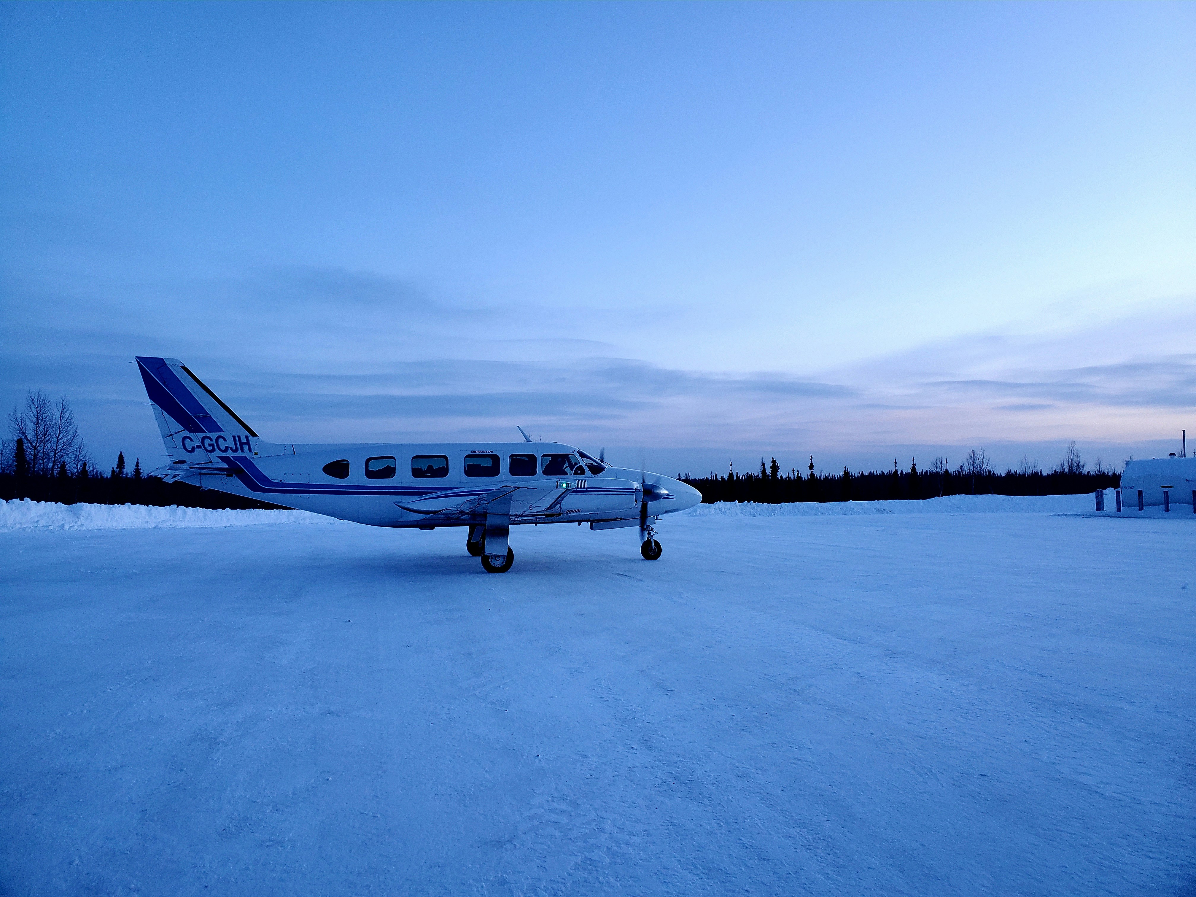 Blue Hour on Ice: A Cessna Resting on Snow Under a Quiet Sky