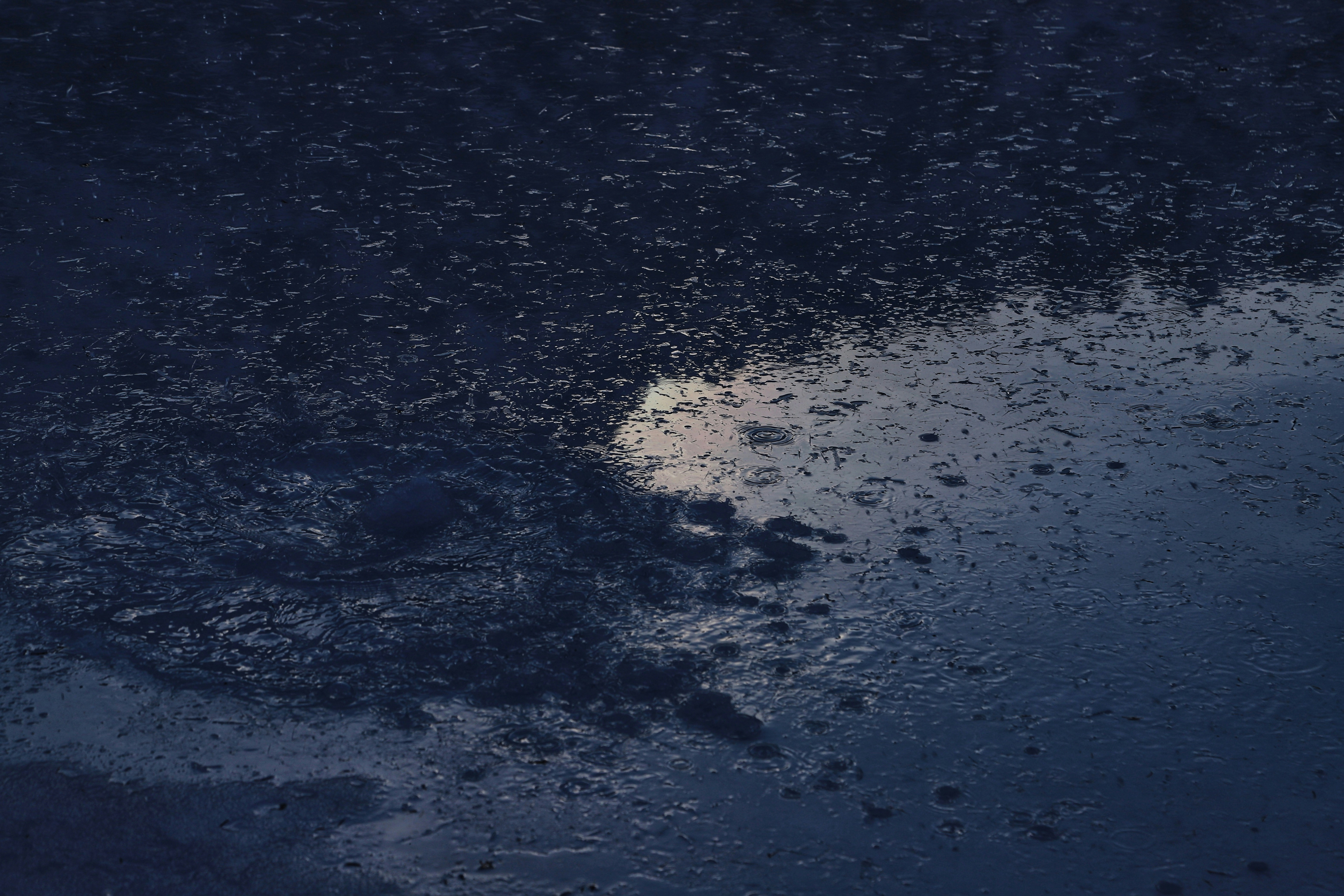 A puddle of water with a moon in the background photo – Free 39030 ...