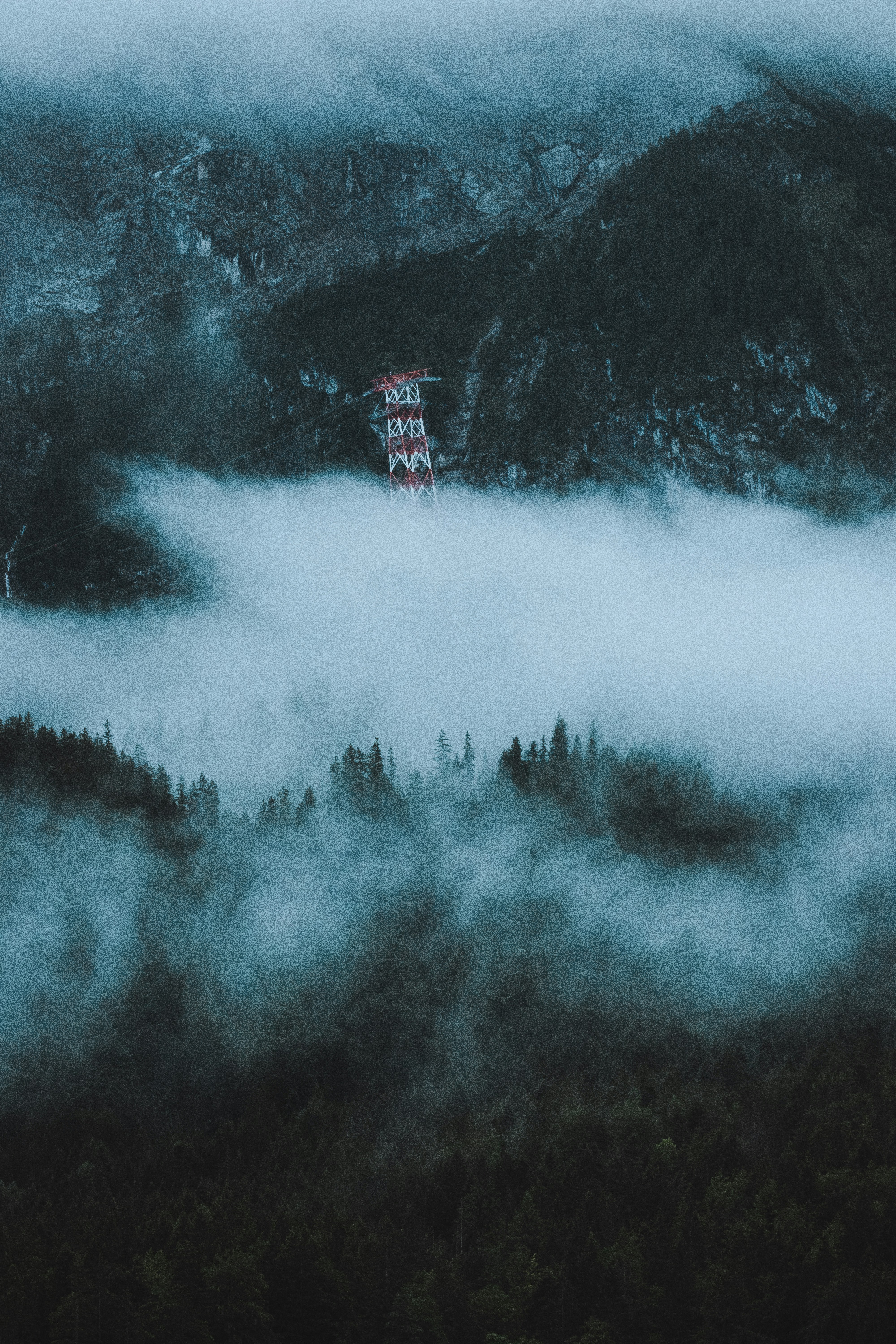 Mist-enshrouded Peak: A Tower Amid the Valley Veil