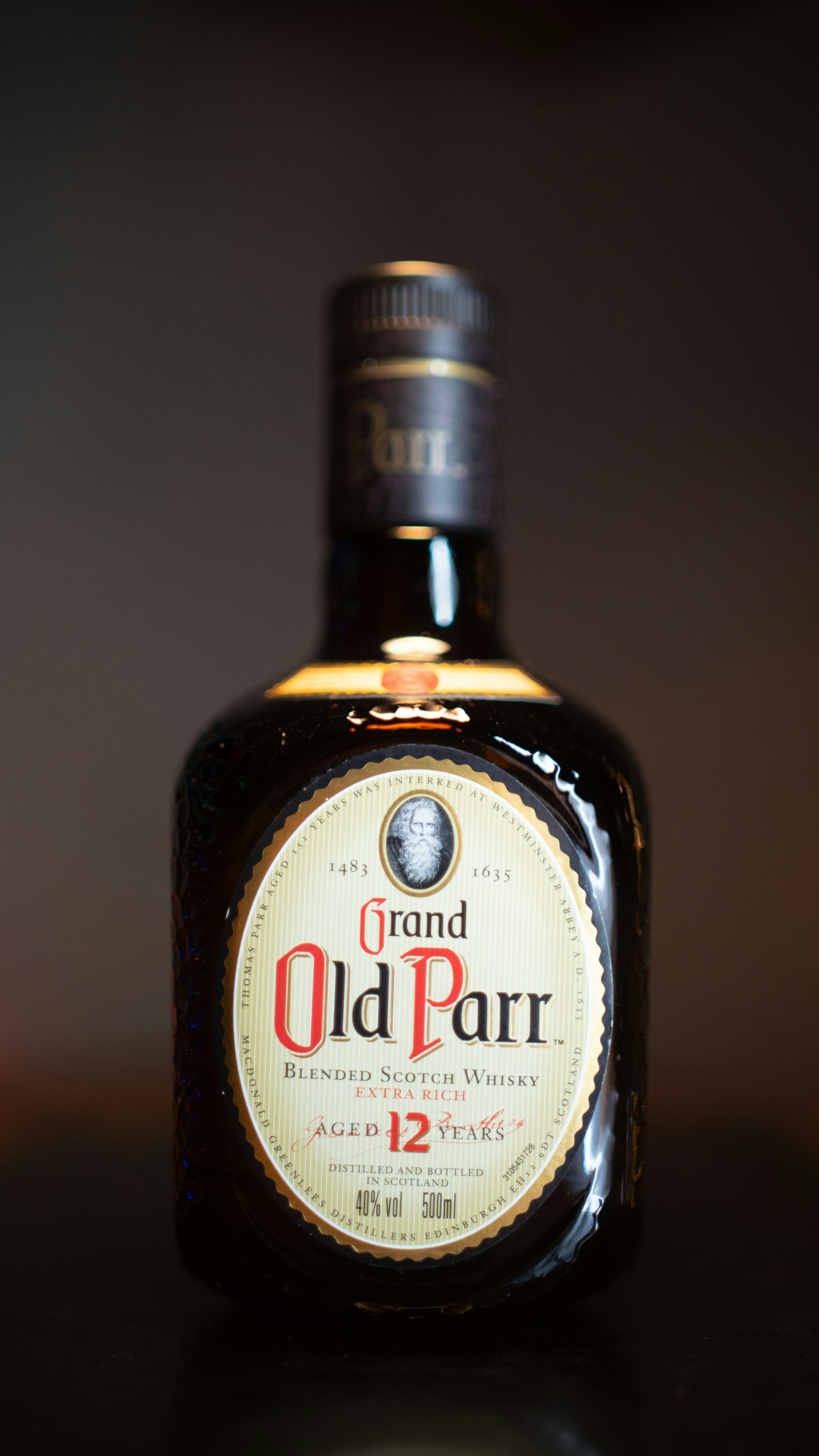 A bottle of old parr on a table photo – Free Aged whiskey Image on Unsplash