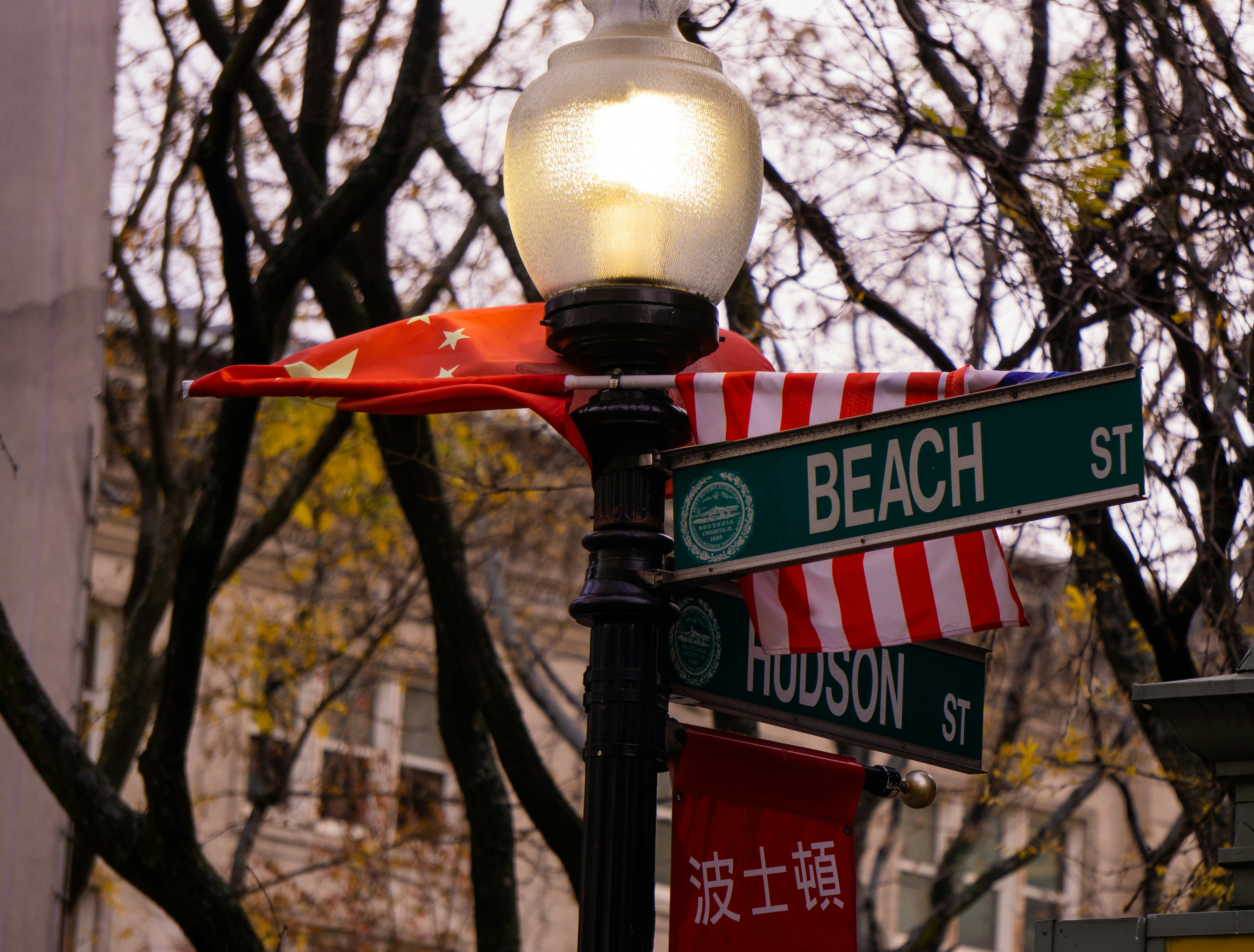 A street light with street signs attached to it photo – Free Street ...