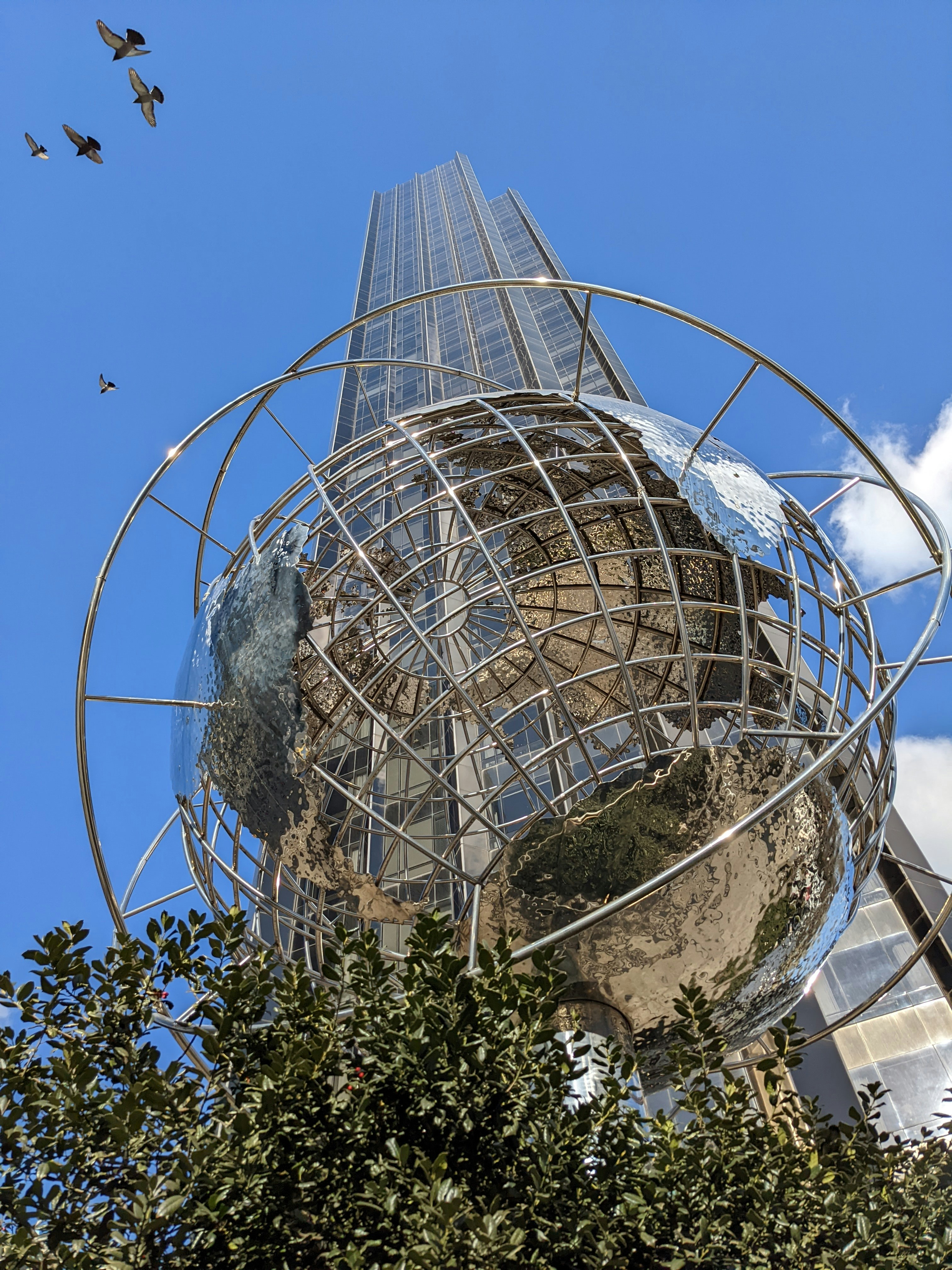 A very tall building with a metal structure on top of it photo – Free ...