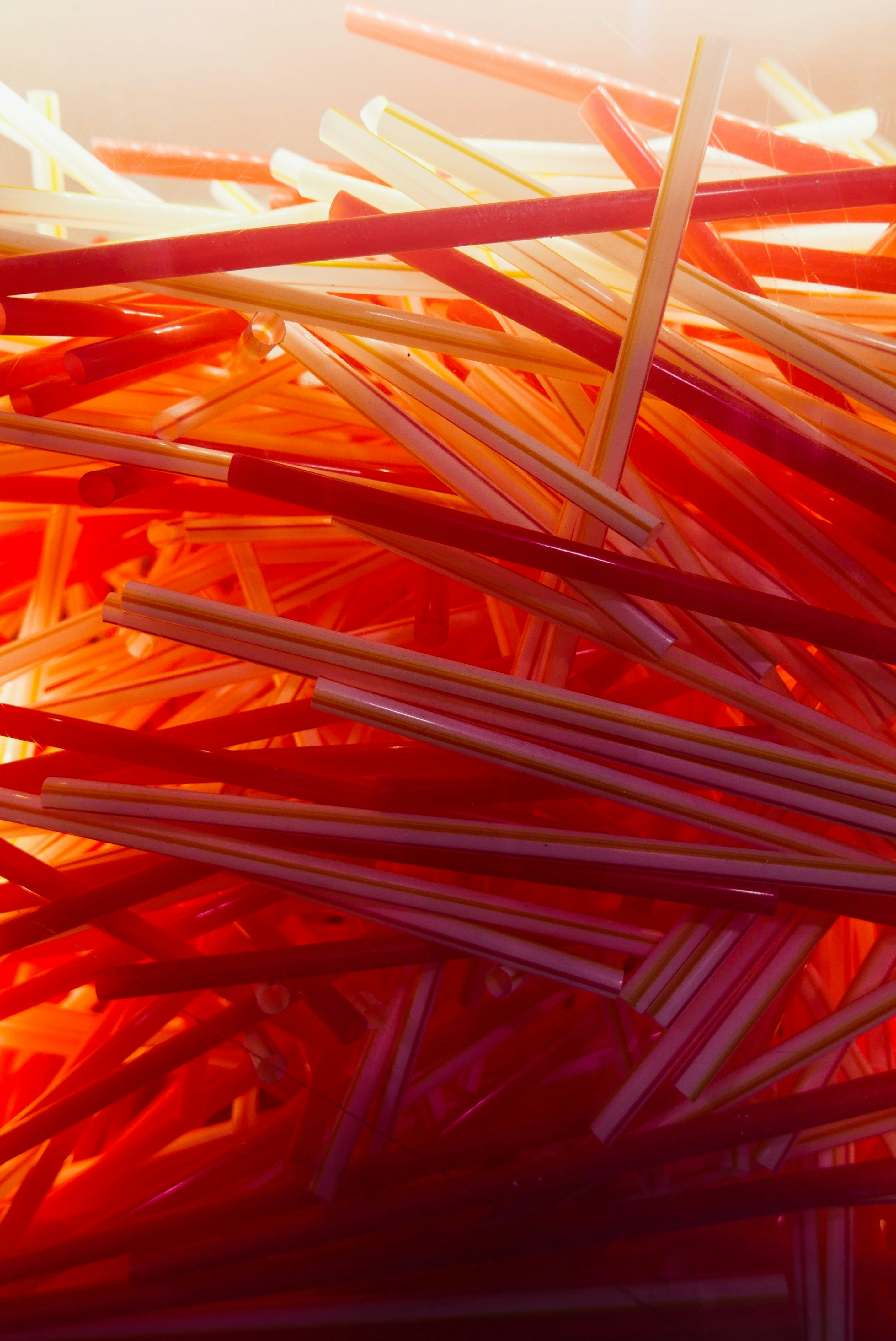 A pile of red and yellow sticks sitting next to each other photo – Free ...