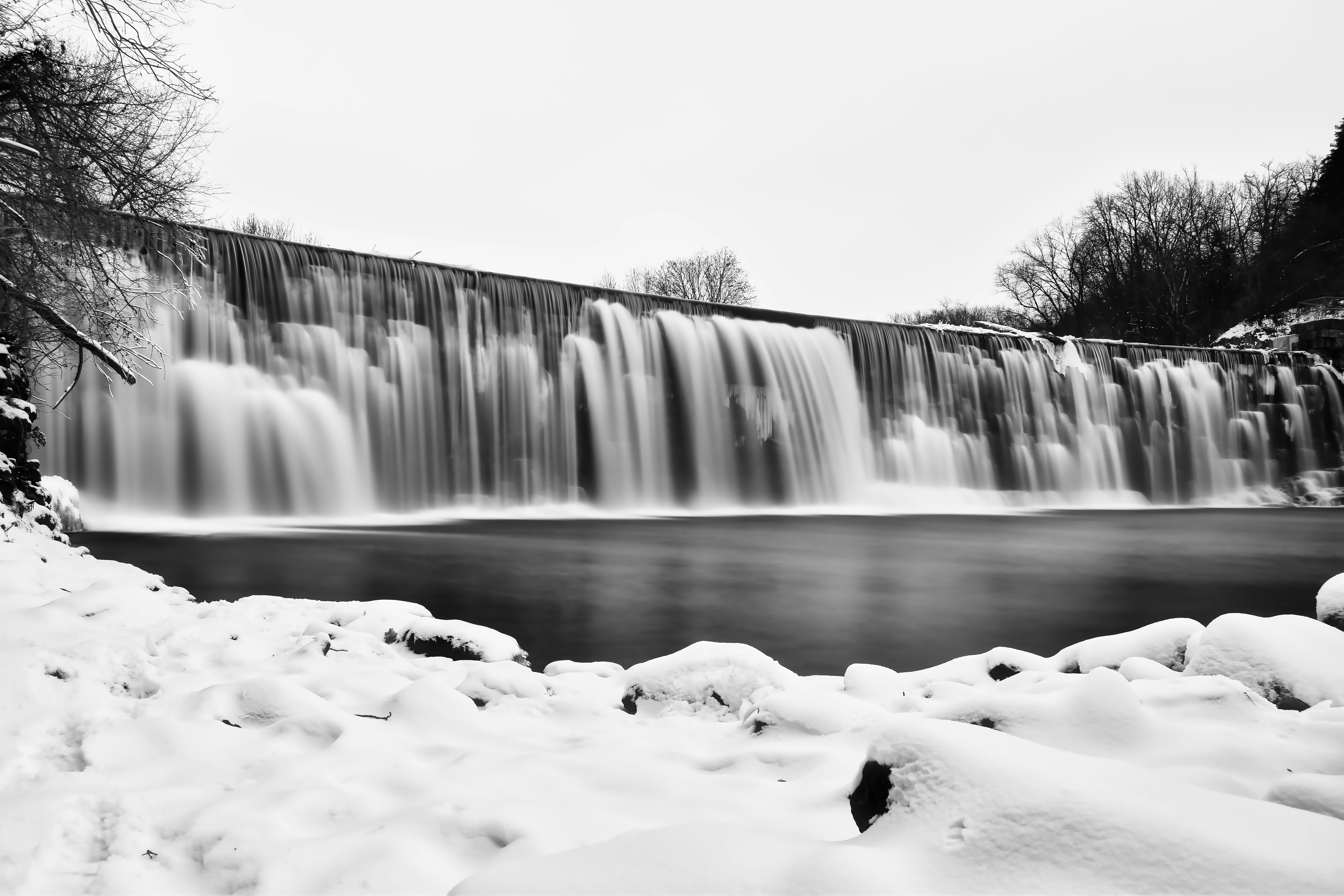 Snowbound Cascade: A Black-and-White Winter Waterfall
