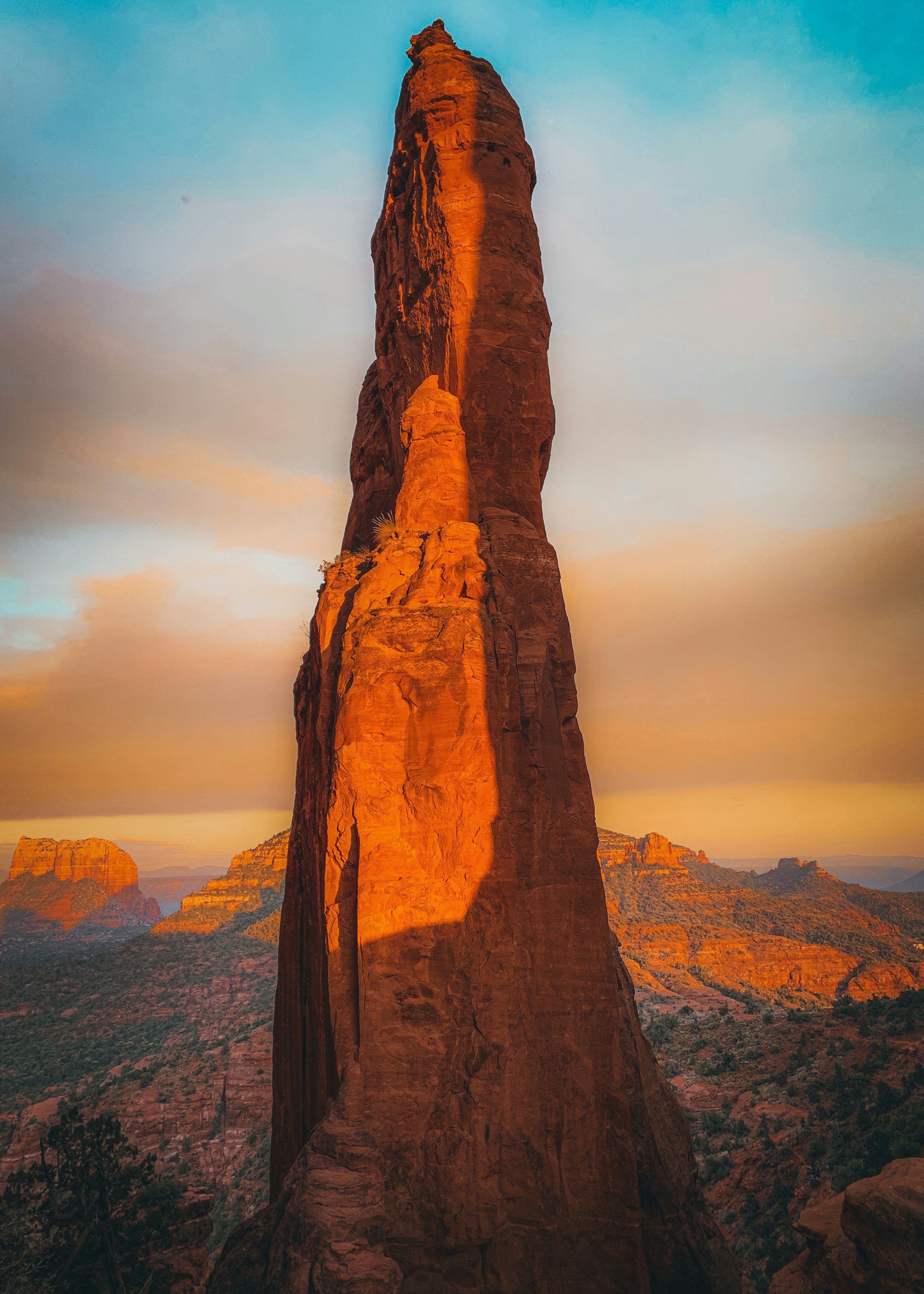 Sunlit Spire Rising Above the Desert Rim