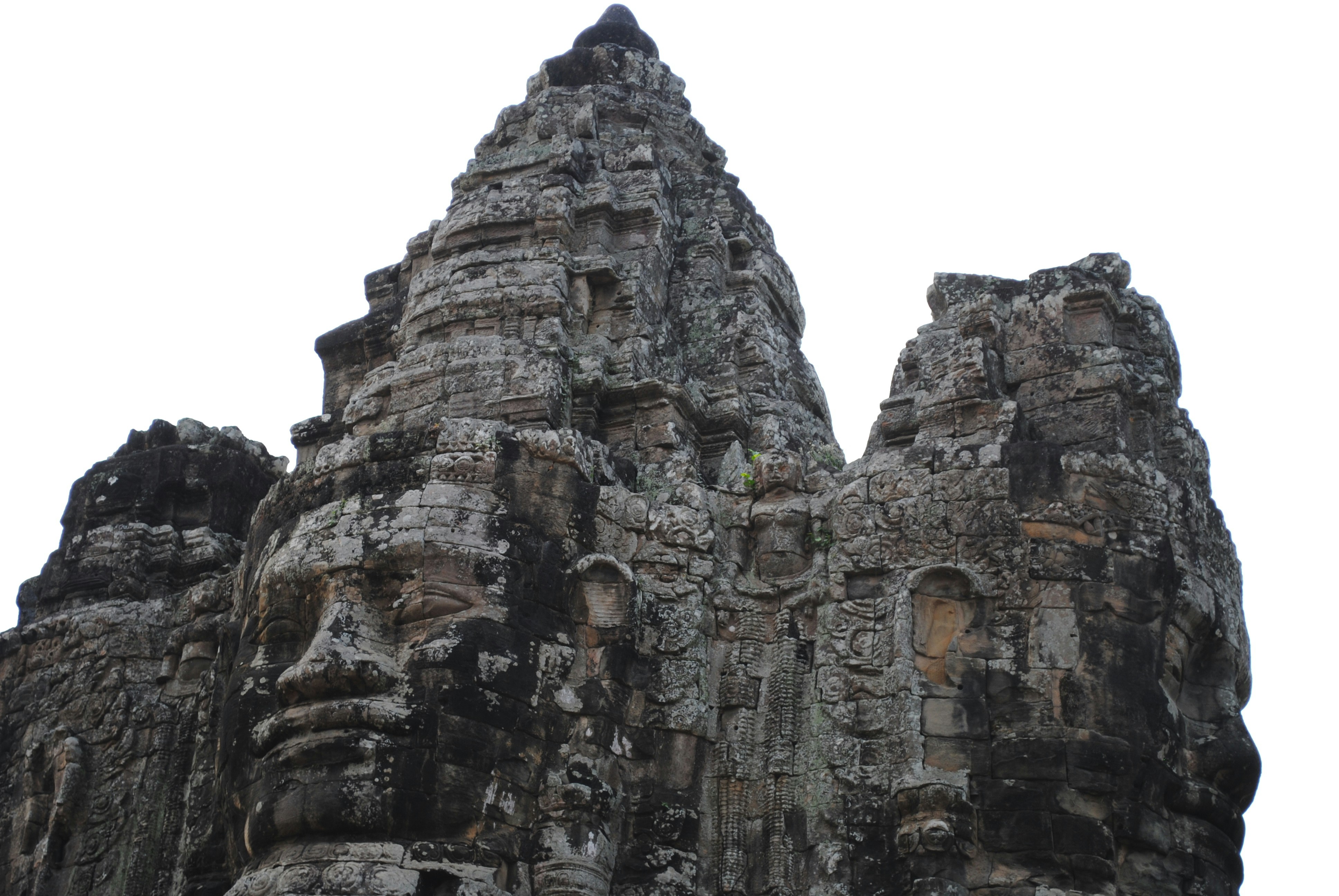 A large stone structure with many faces on it photo – Free Angkor wat ...