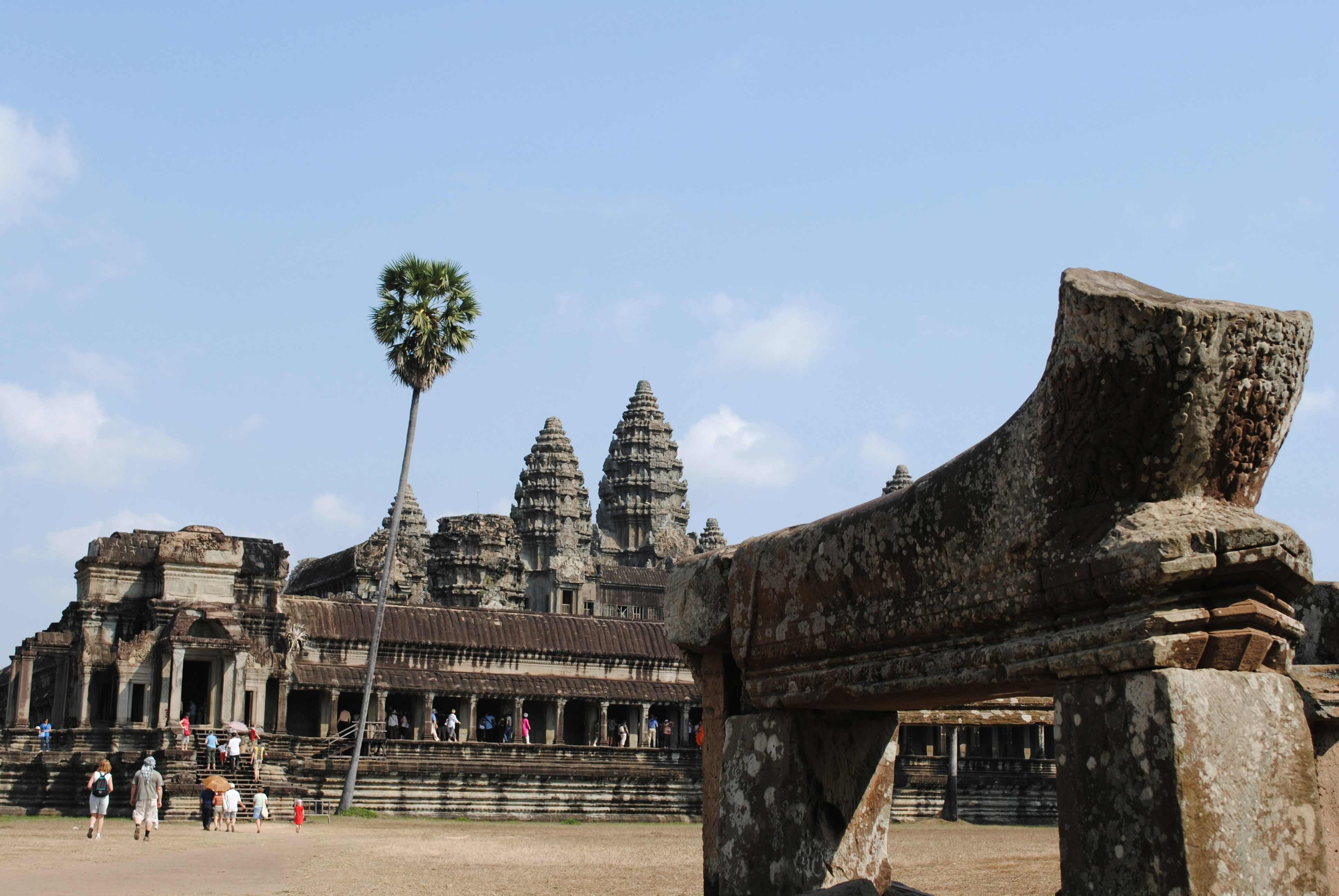 A stone bench in front of a large building photo – Free Angkor wat ...