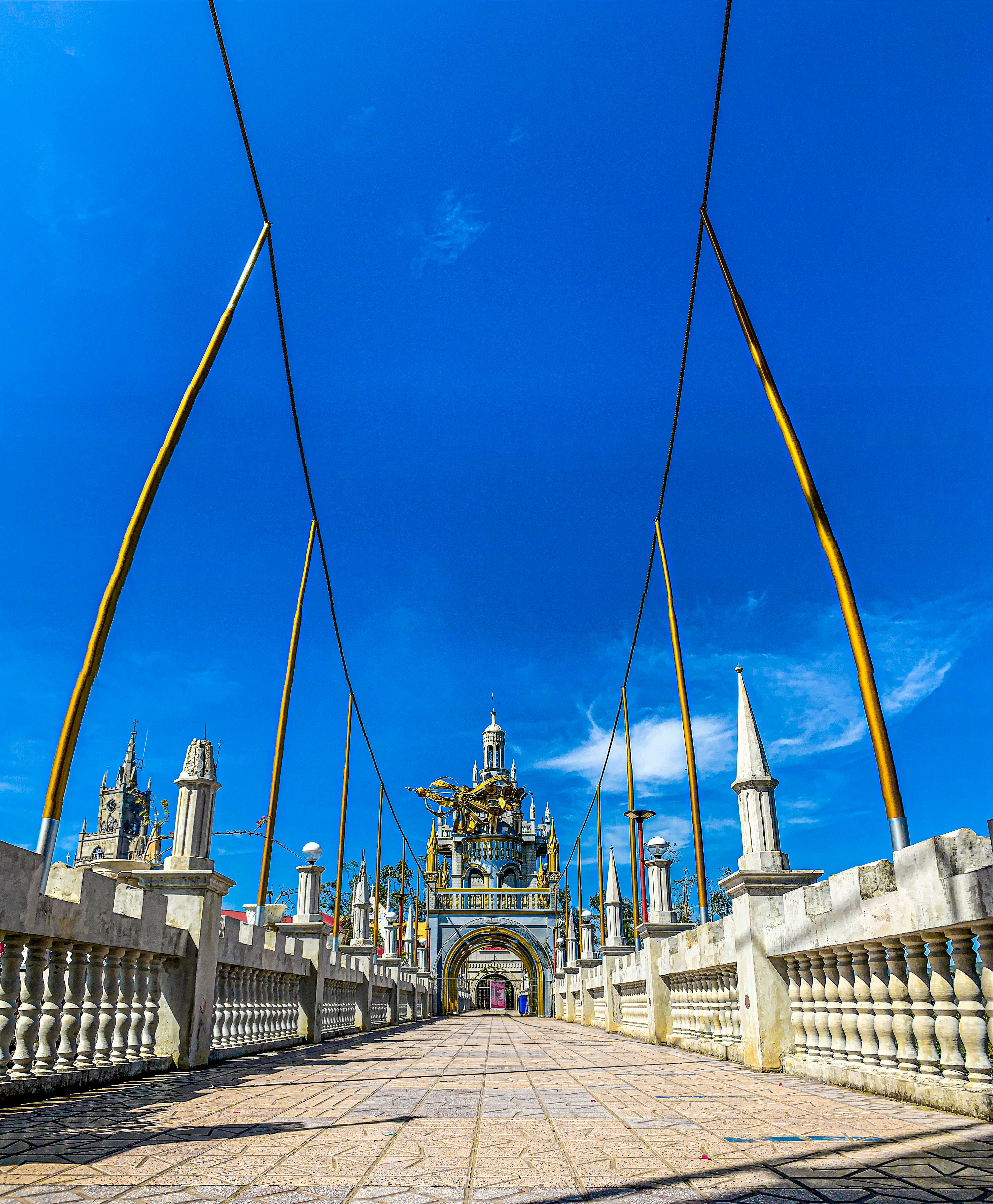 A bridge with a clock tower in the background photo – Free Railing ...
