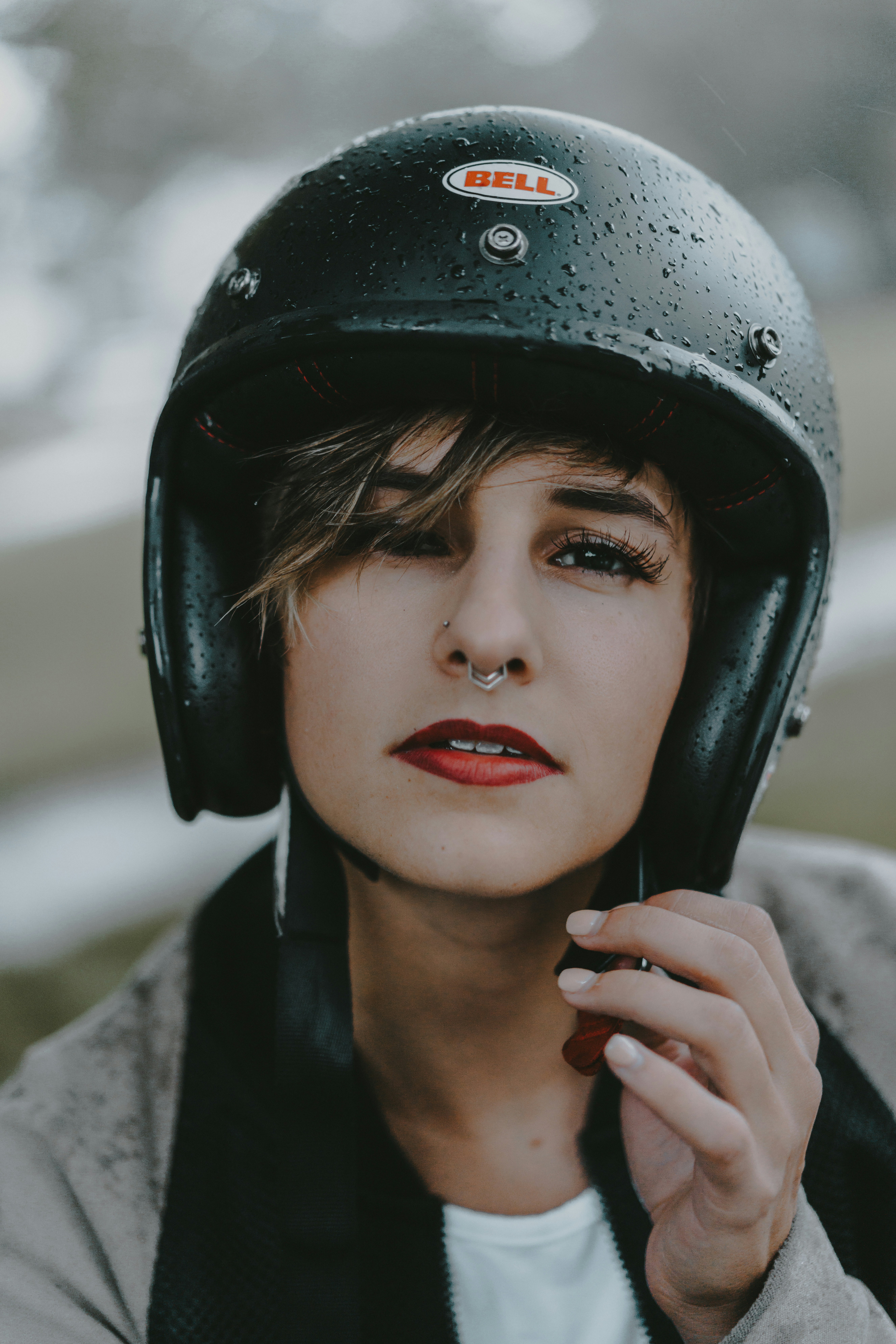 Rain-Kissed Focus: Close-Up Under a Bell Helmet