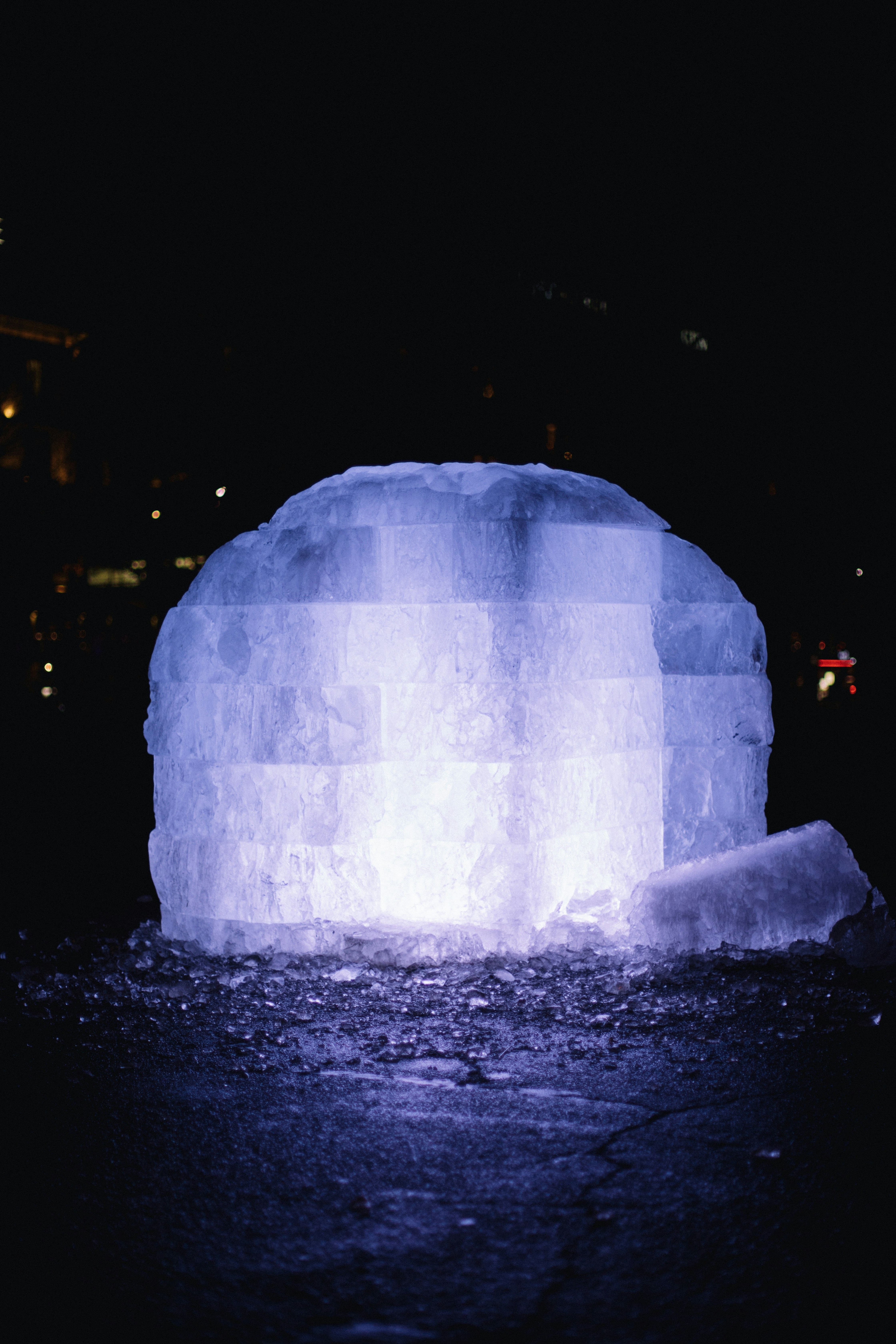a large ice block sitting on top of a sidewalk