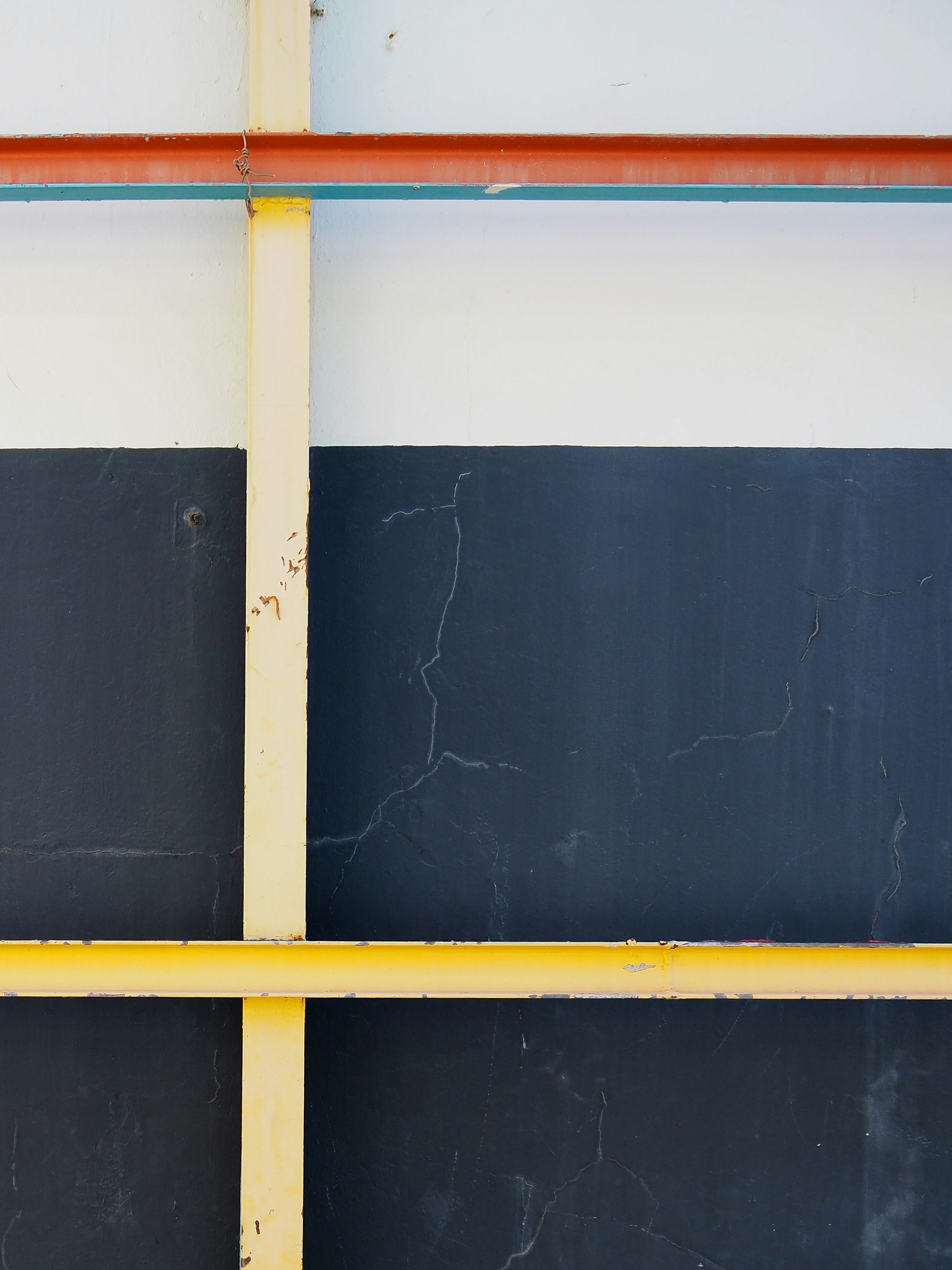 A black and white wall with yellow bars photo – Free Sint maarten Image ...