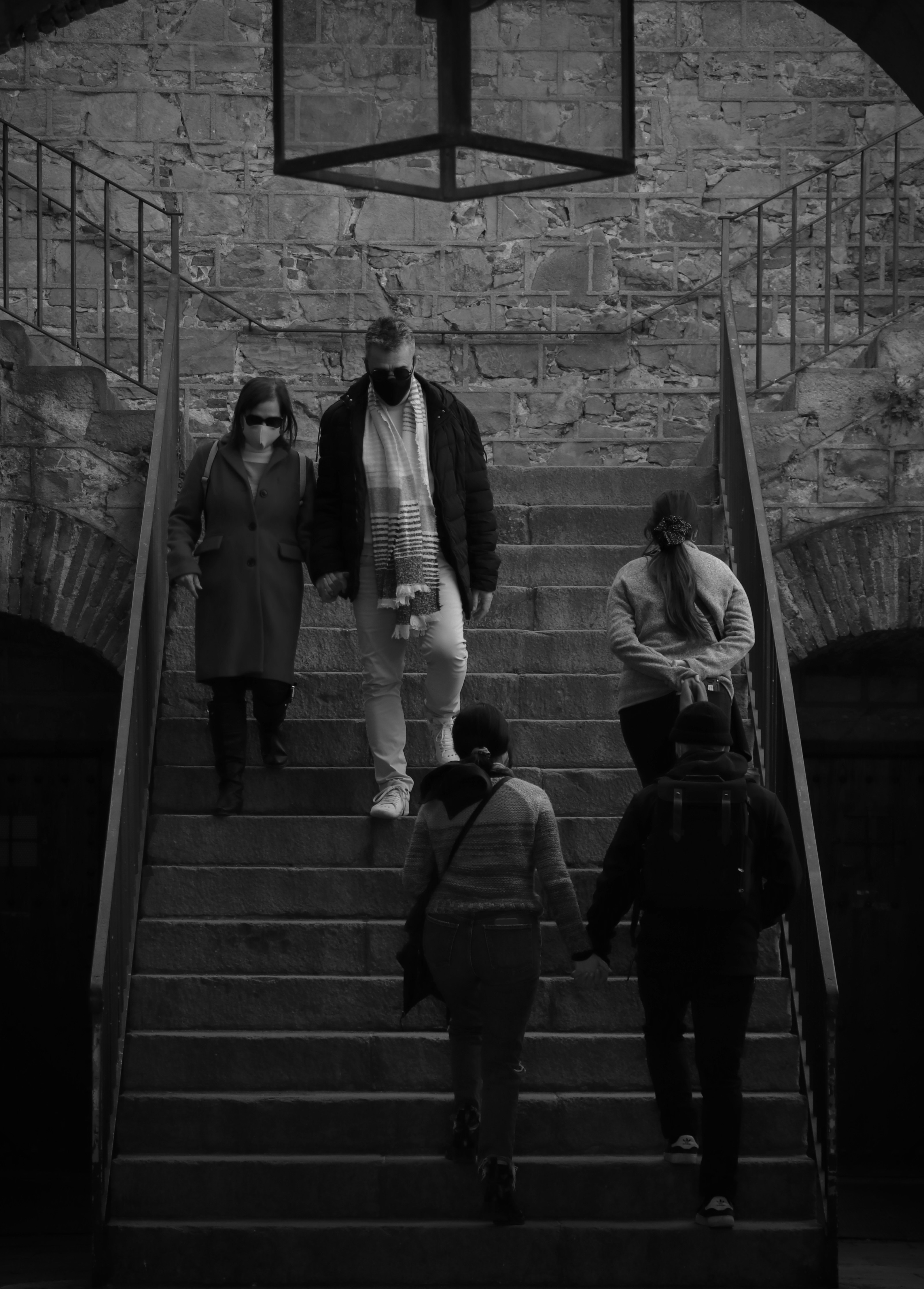 a group of people walking down a flight of stairs