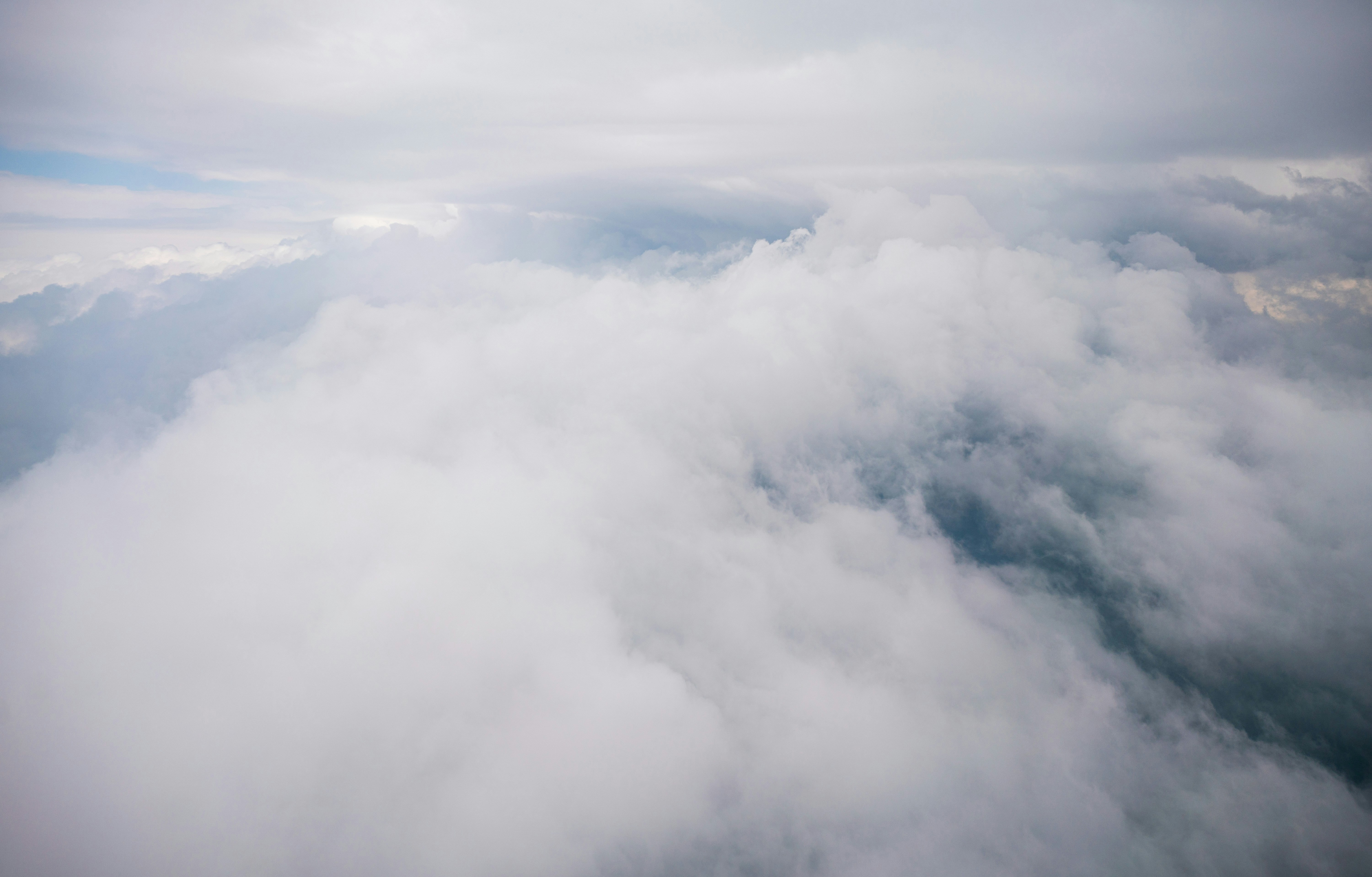 Vast expanse of clouds enveloping the horizon, creating a serene and ethereal atmosphere.