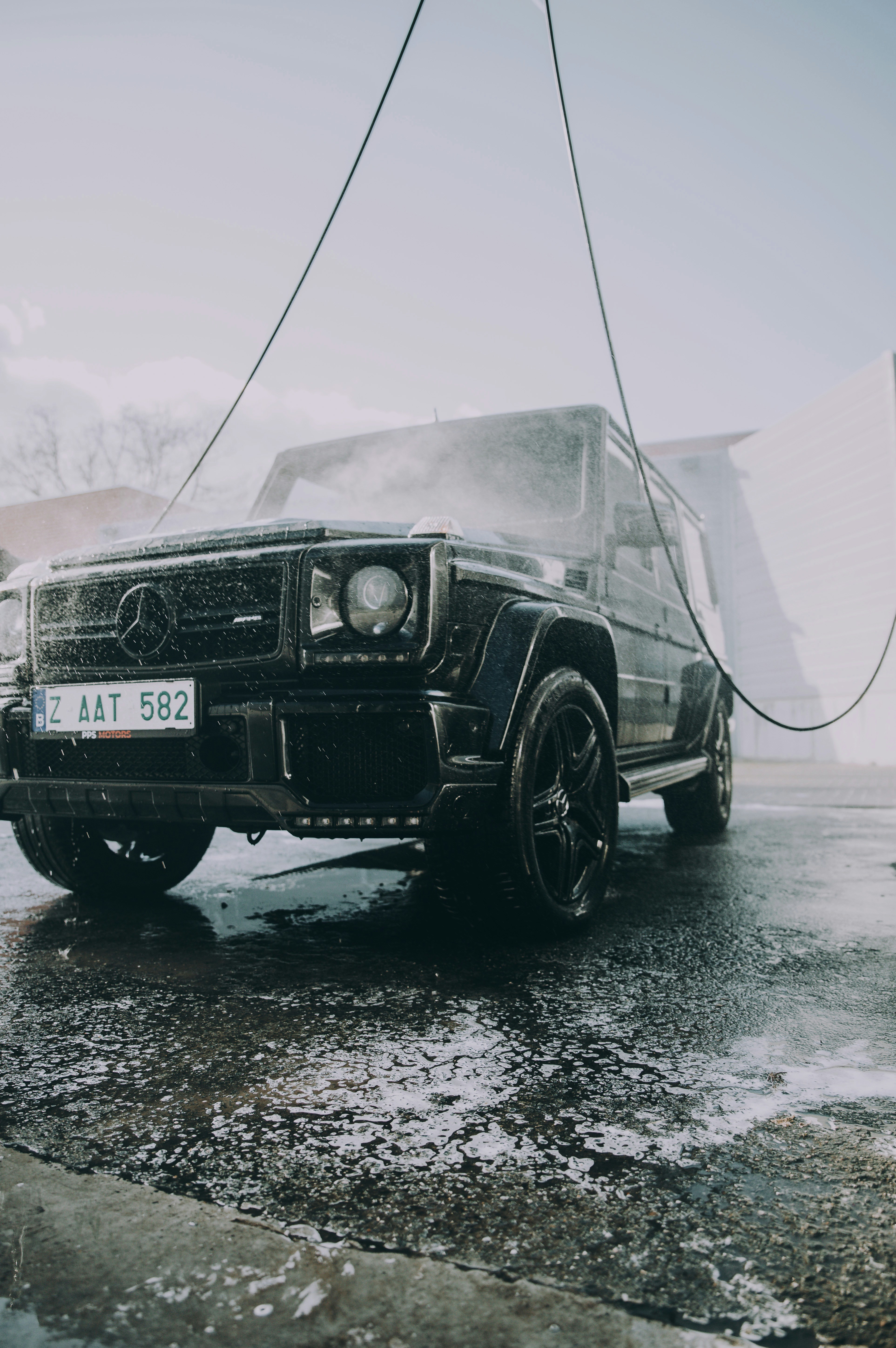 G-Wagen in Steam: A Low-Angle Portrait of Steel and Spray