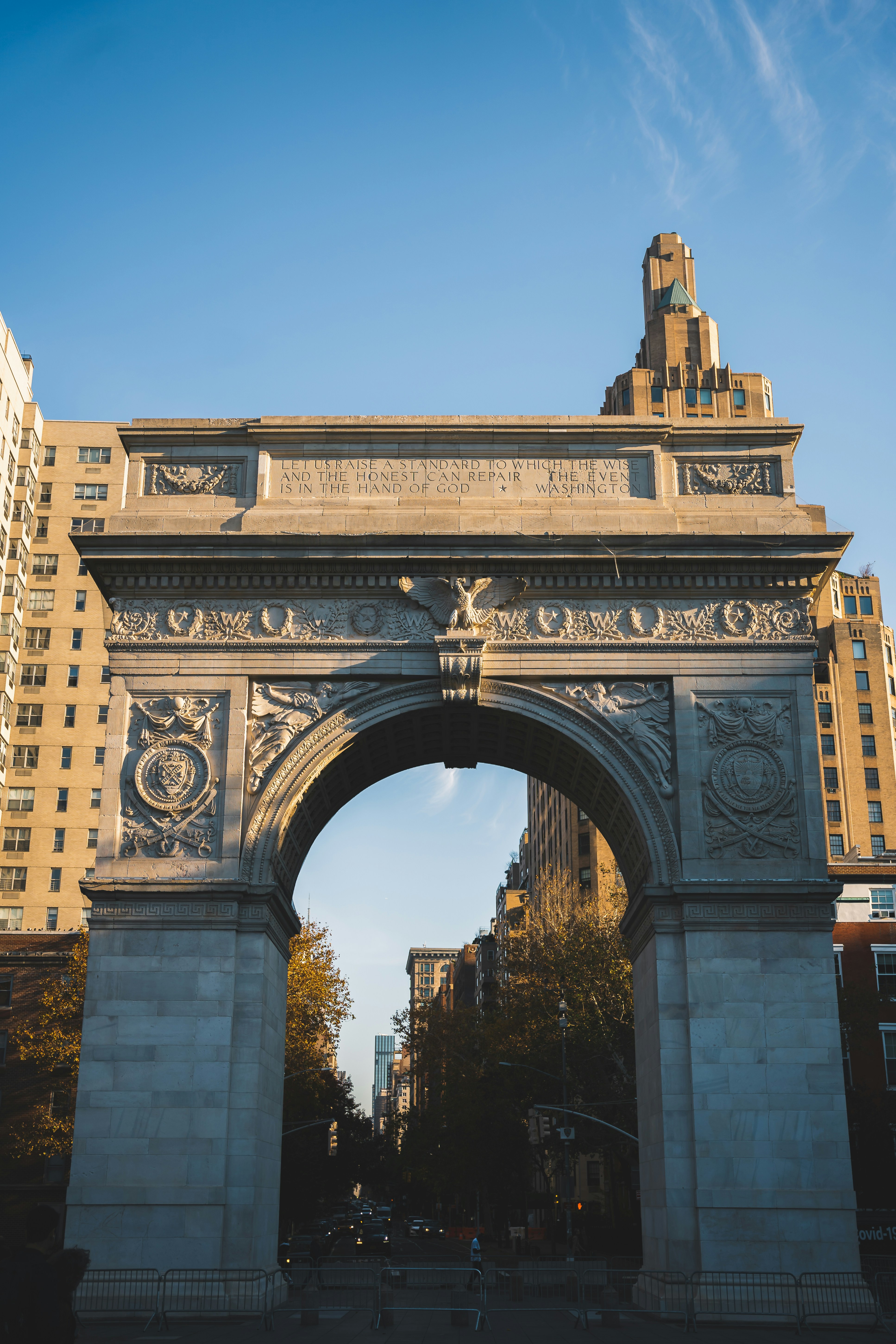 The Arch’s Quiet Gate: Sunlit Street Through Ornate Stonework