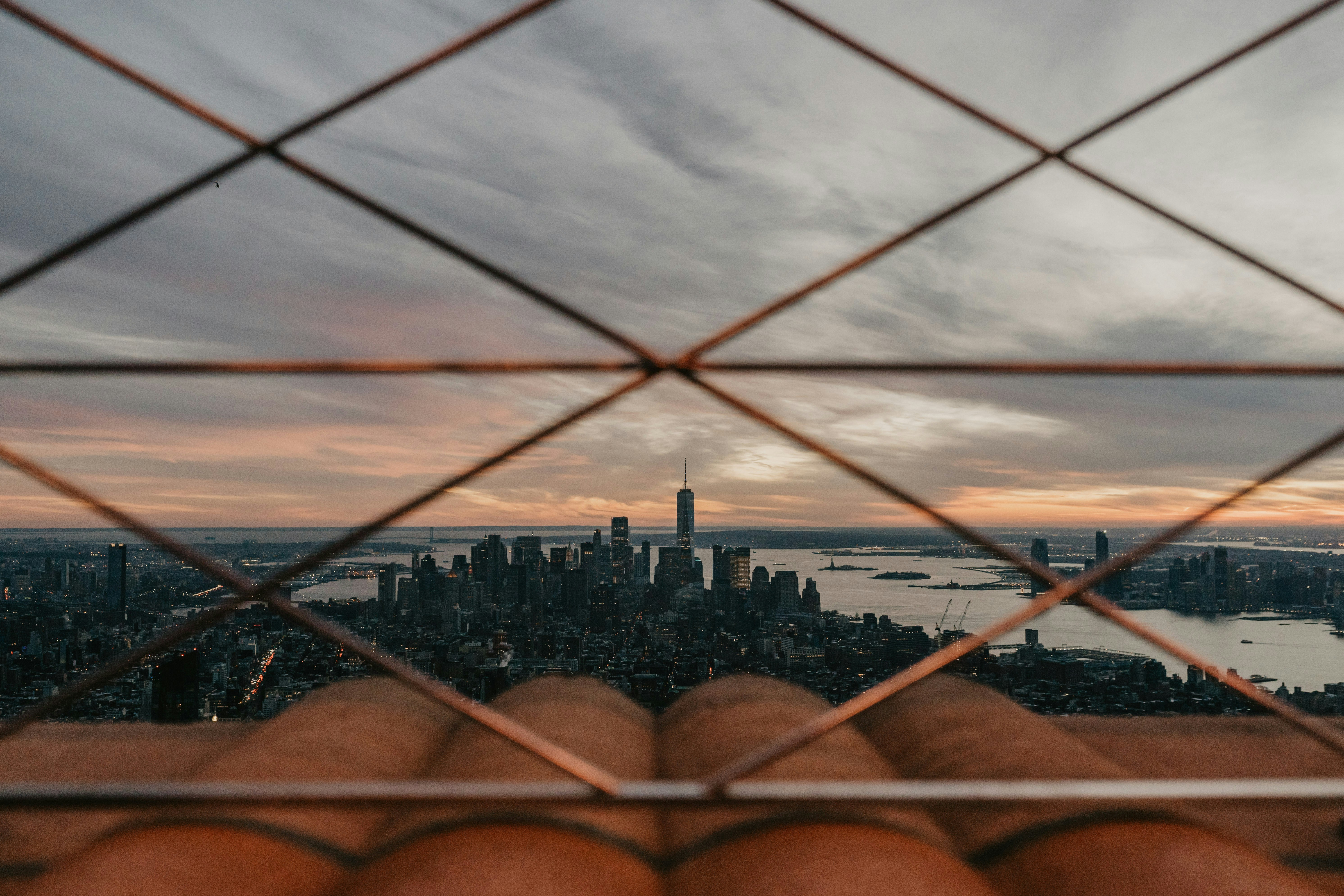 Twilight Through a Copper Mesh: Manhattan Framed by Diamond Fence