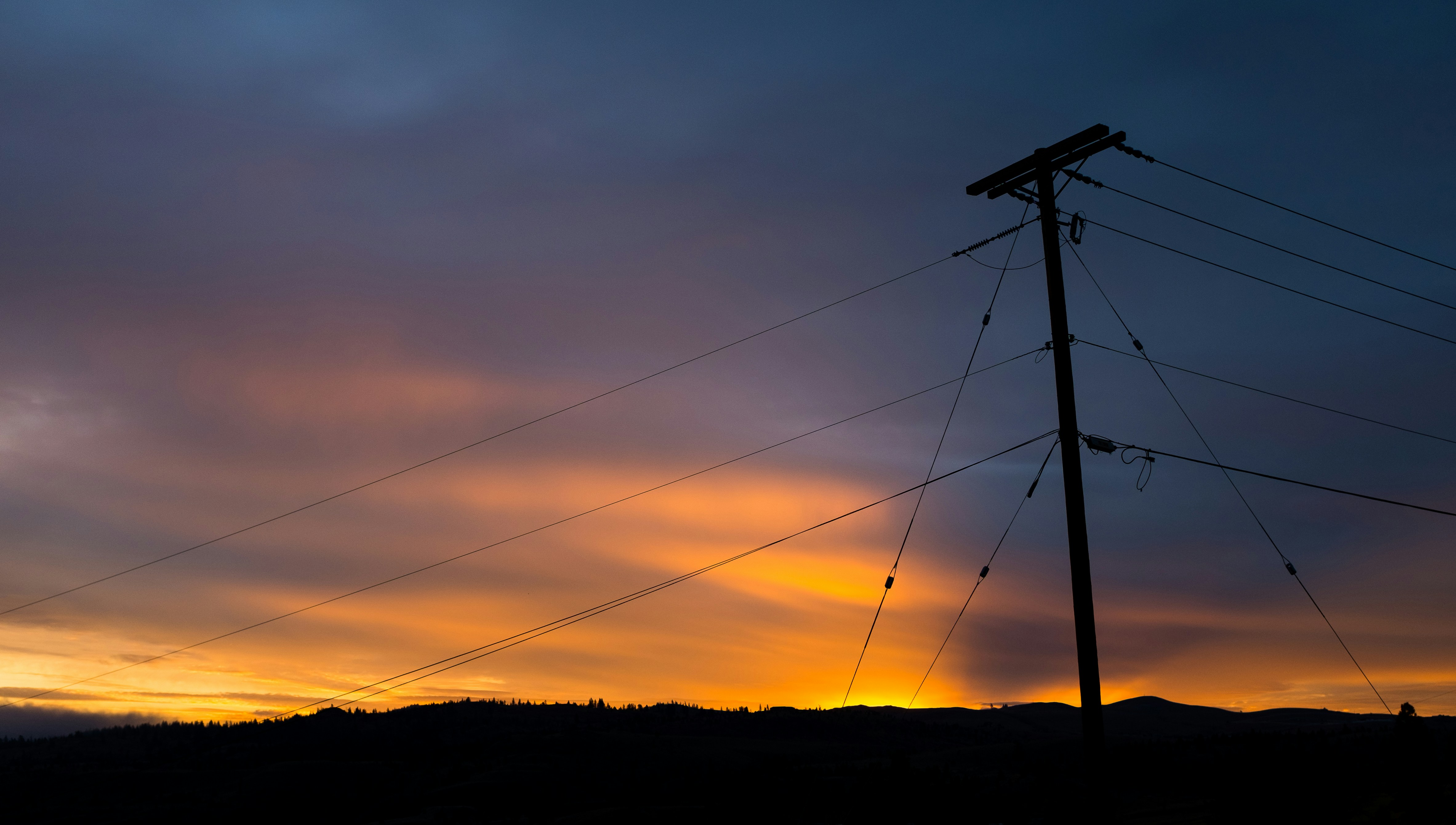 The sun is setting behind a telephone pole photo – Free Kamloops Image ...