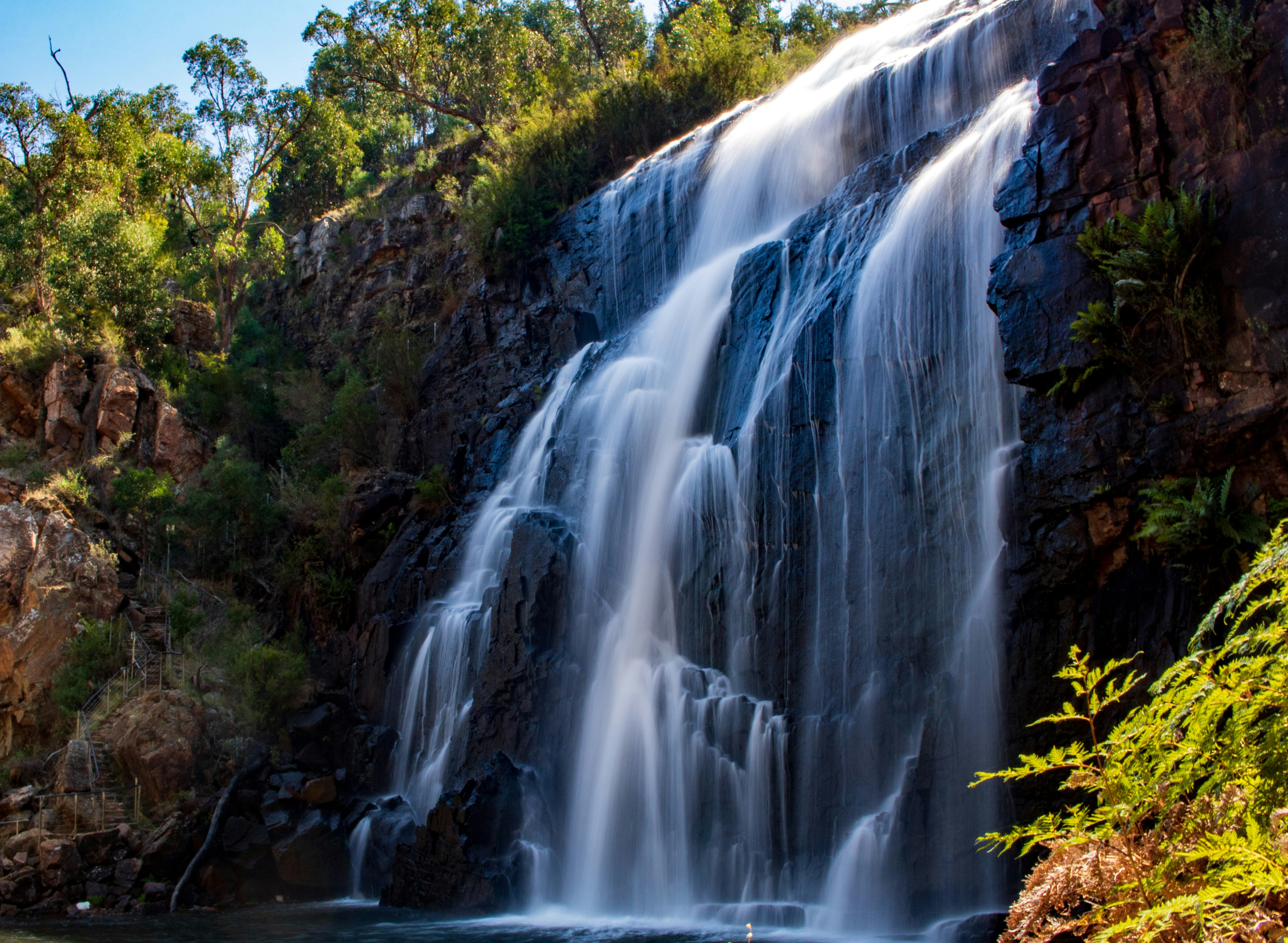 A large waterfall with lots of water coming out of it photo – Free ...