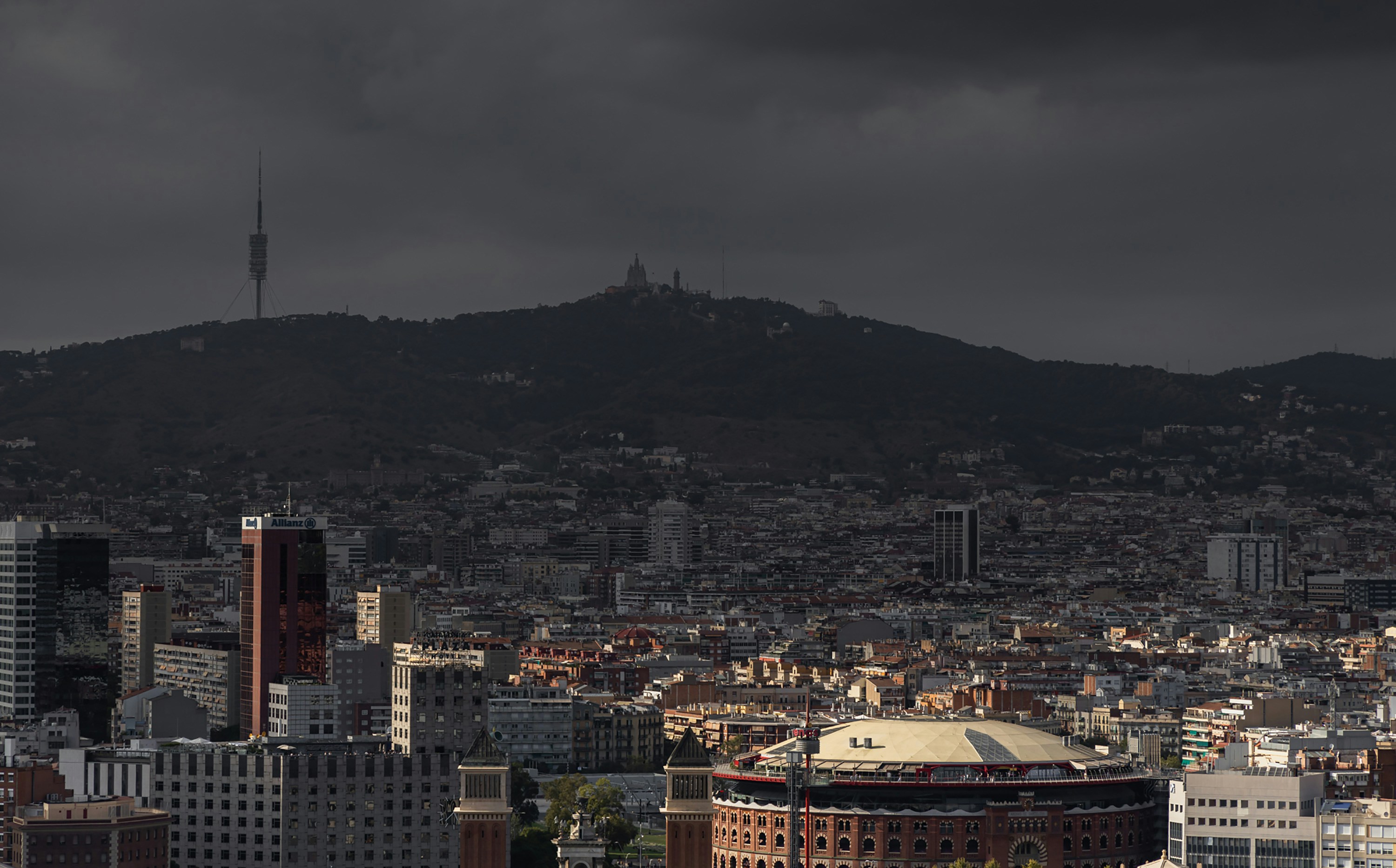 a view of a city with a mountain in the background