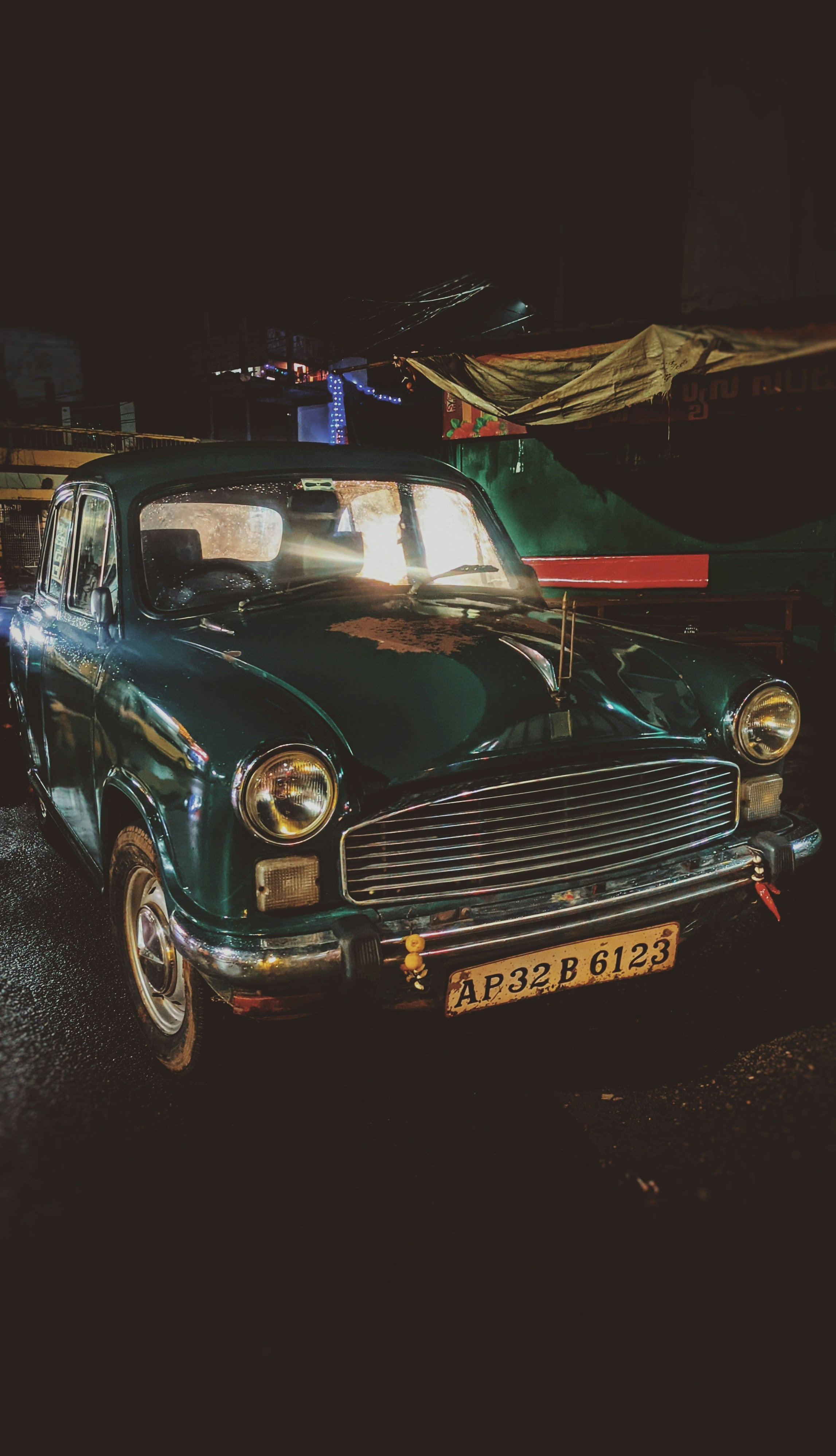 A green car parked on the side of the road photo – Free Tuni Image on ...