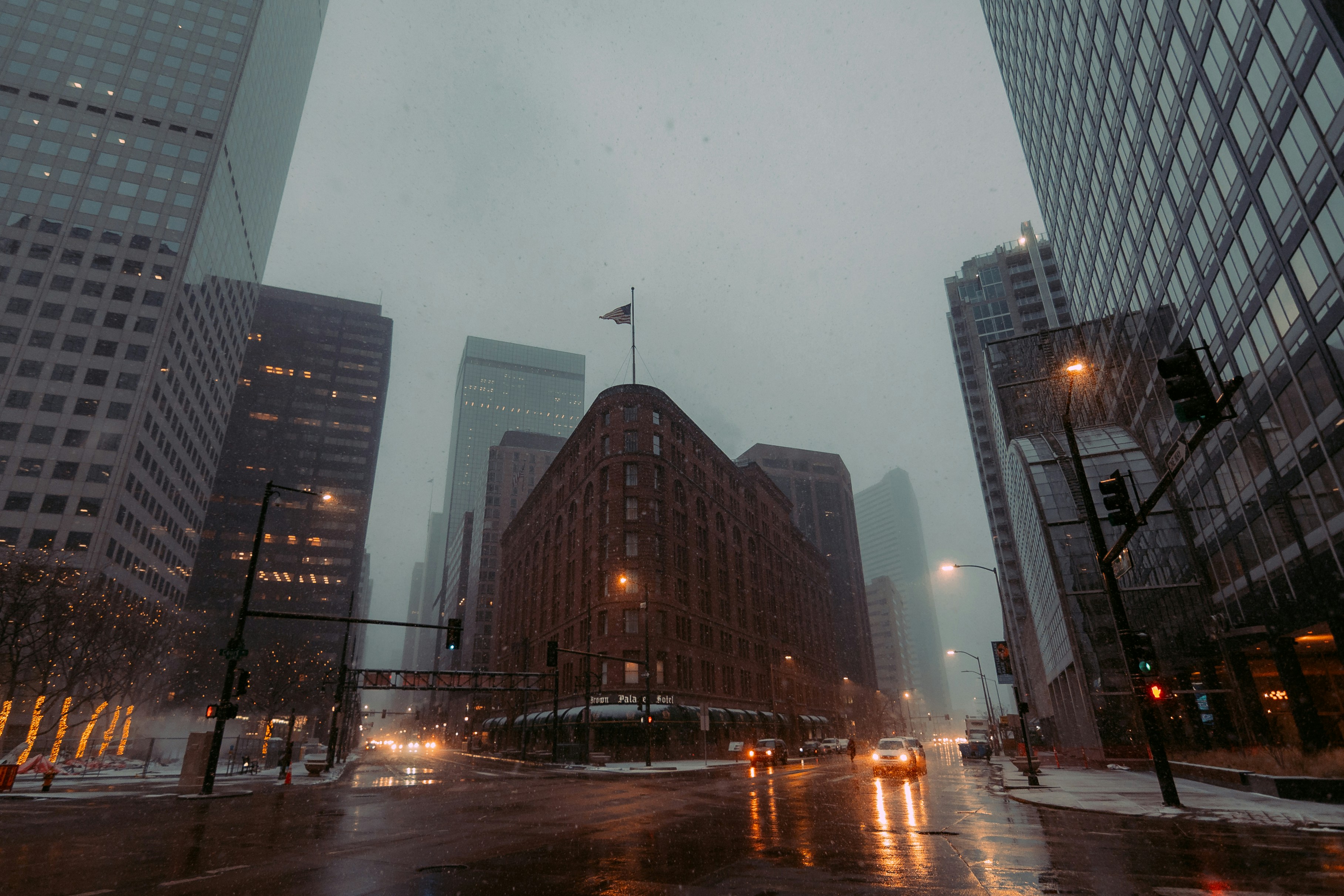 A city street with tall buildings on a rainy day photo – Free Denver ...