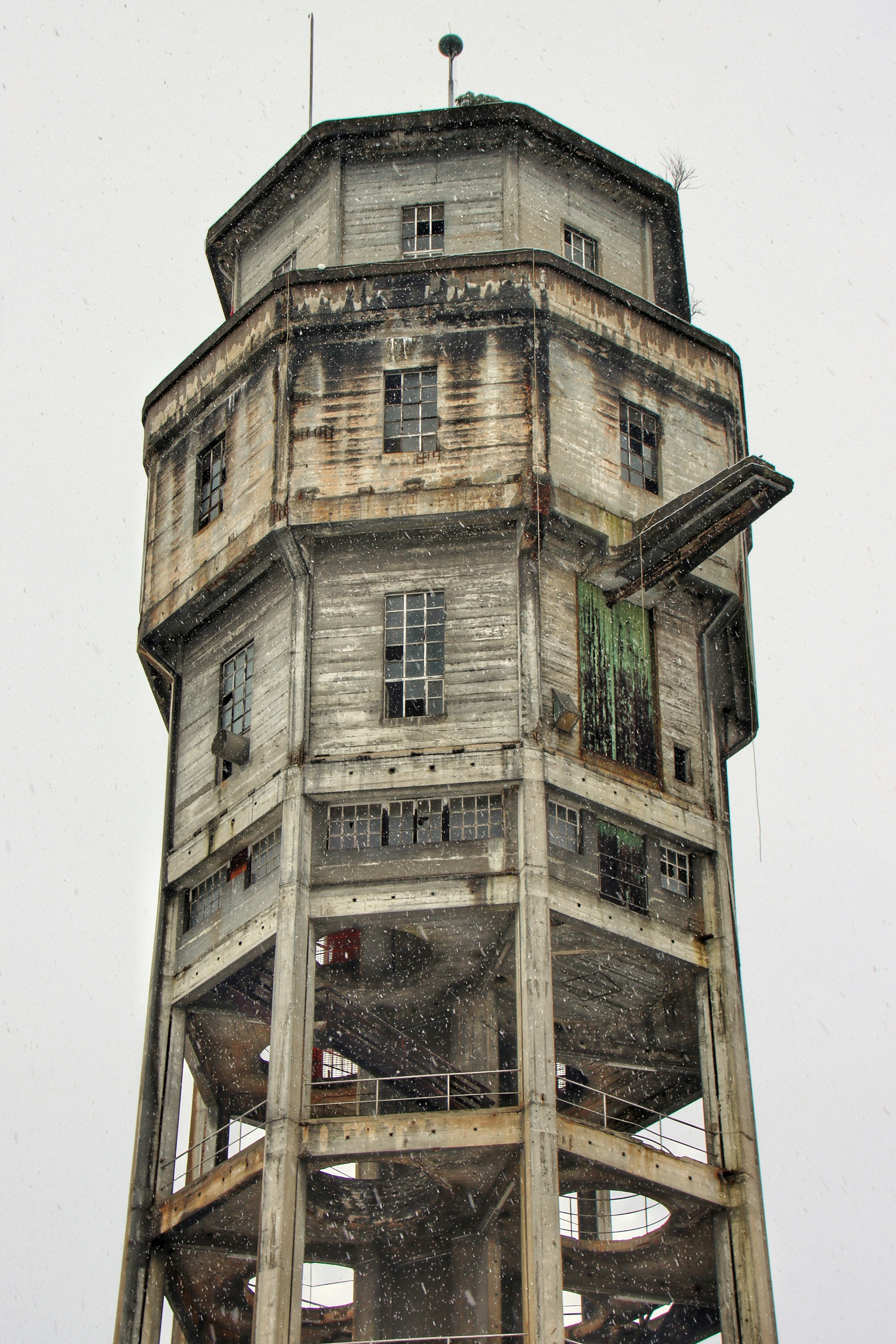 a tall tower with a clock on the top of it
