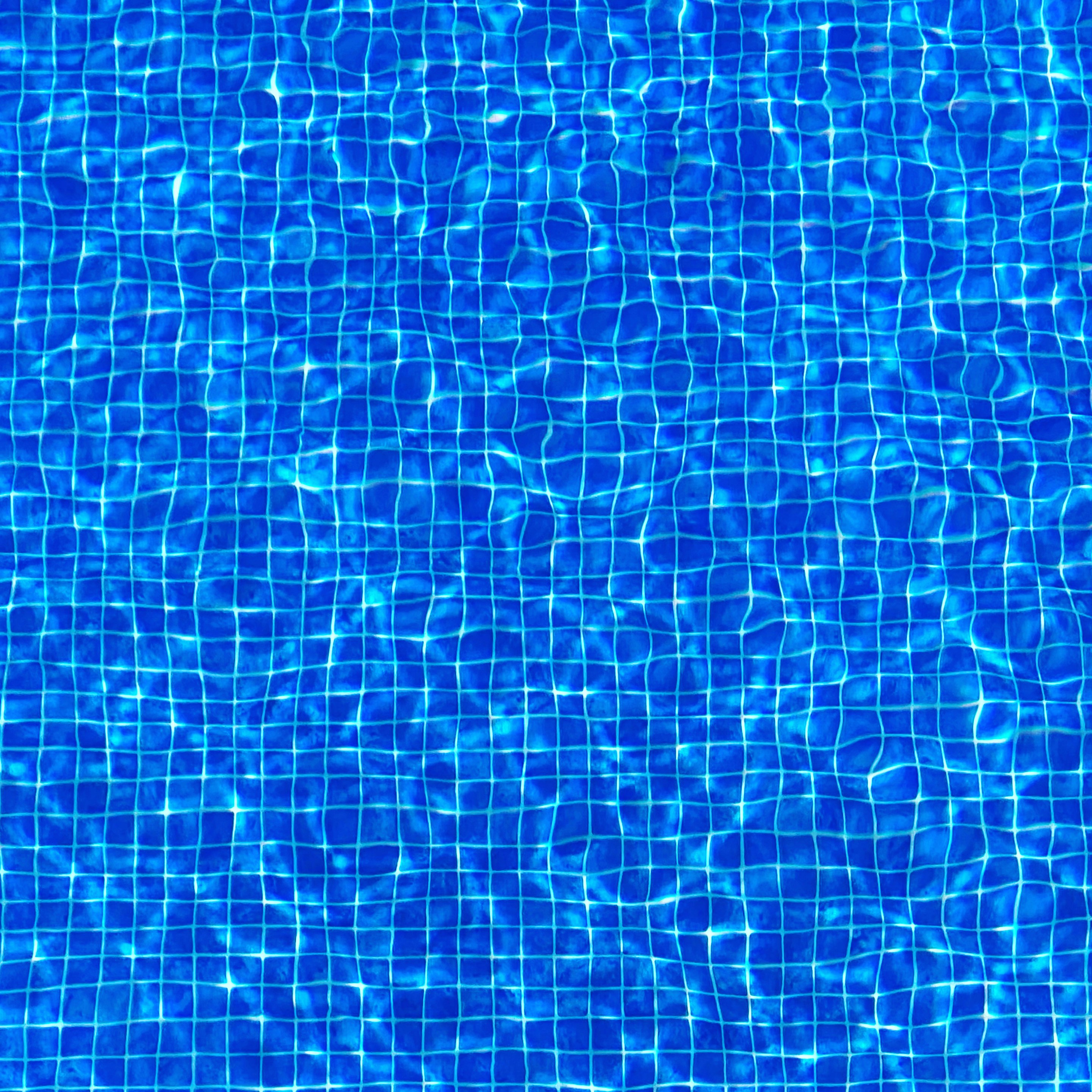 A blue swimming pool with water ripples photo – Free Pool Image on Unsplash