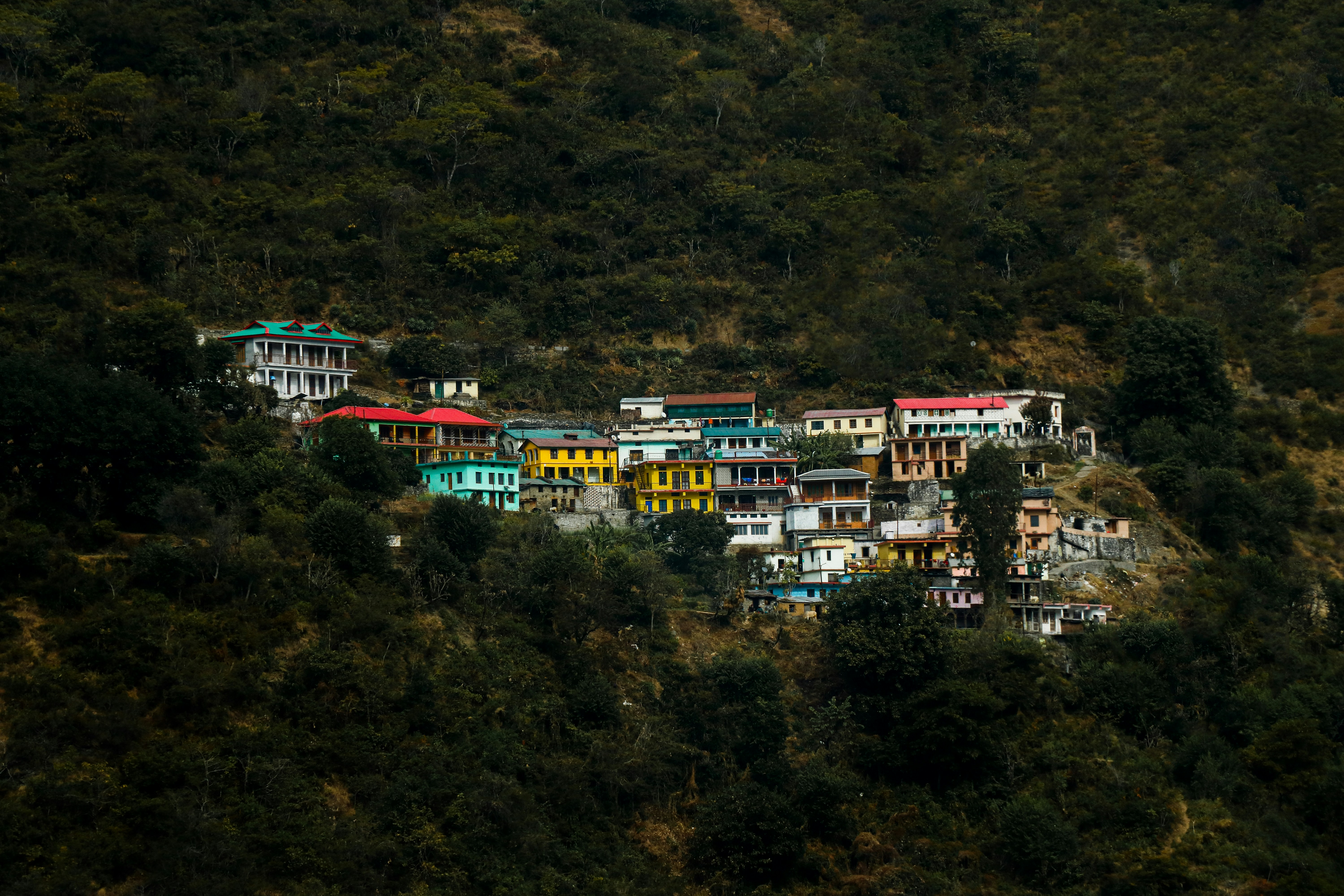 A hillside with a bunch of houses on top of it photo – Free Building ...