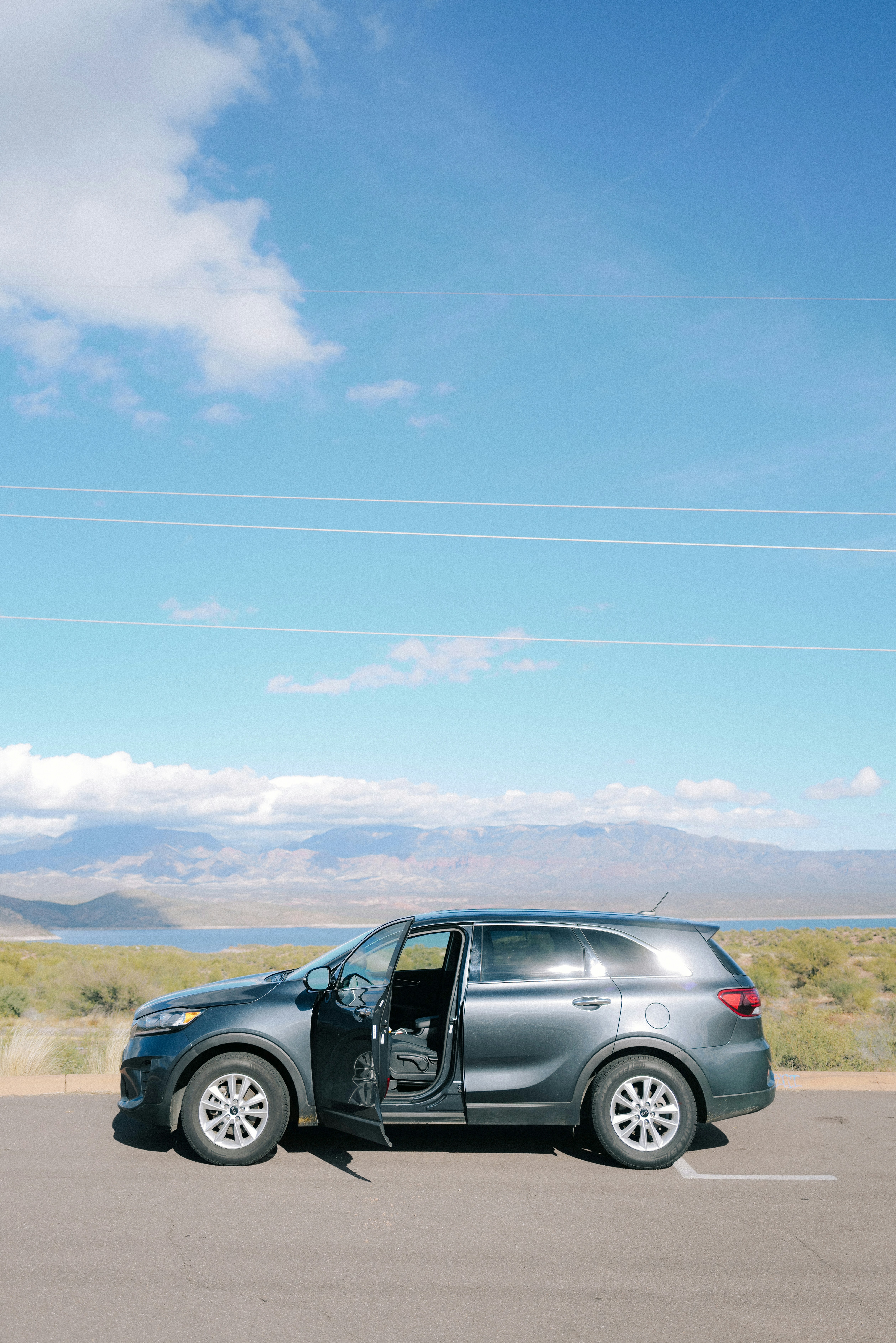 A car with its door open on the side of the road photo – Free Car Image ...