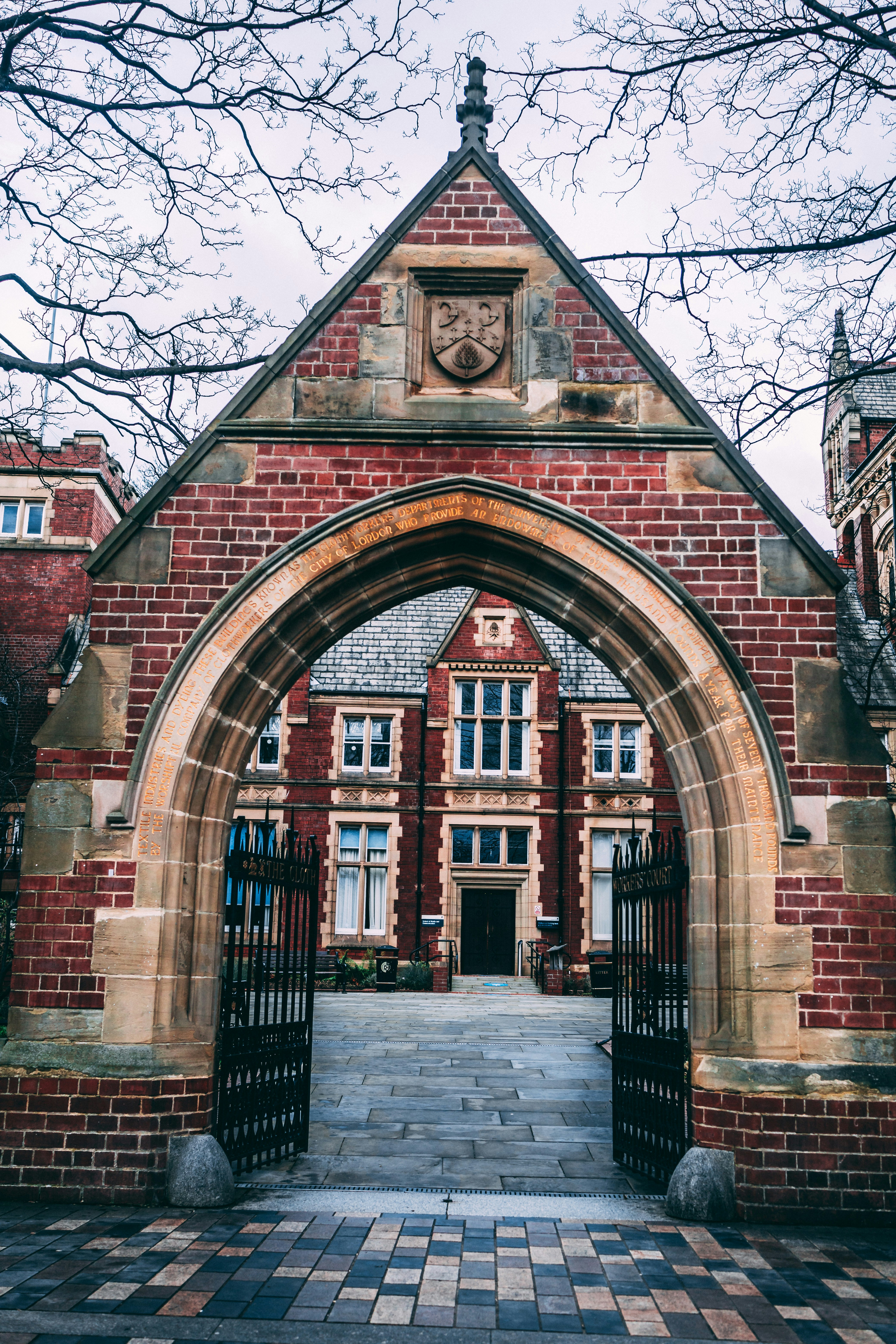 Gateway Arch: A Red-Brick Gothic Portal to the Quiet Campus Courtyard