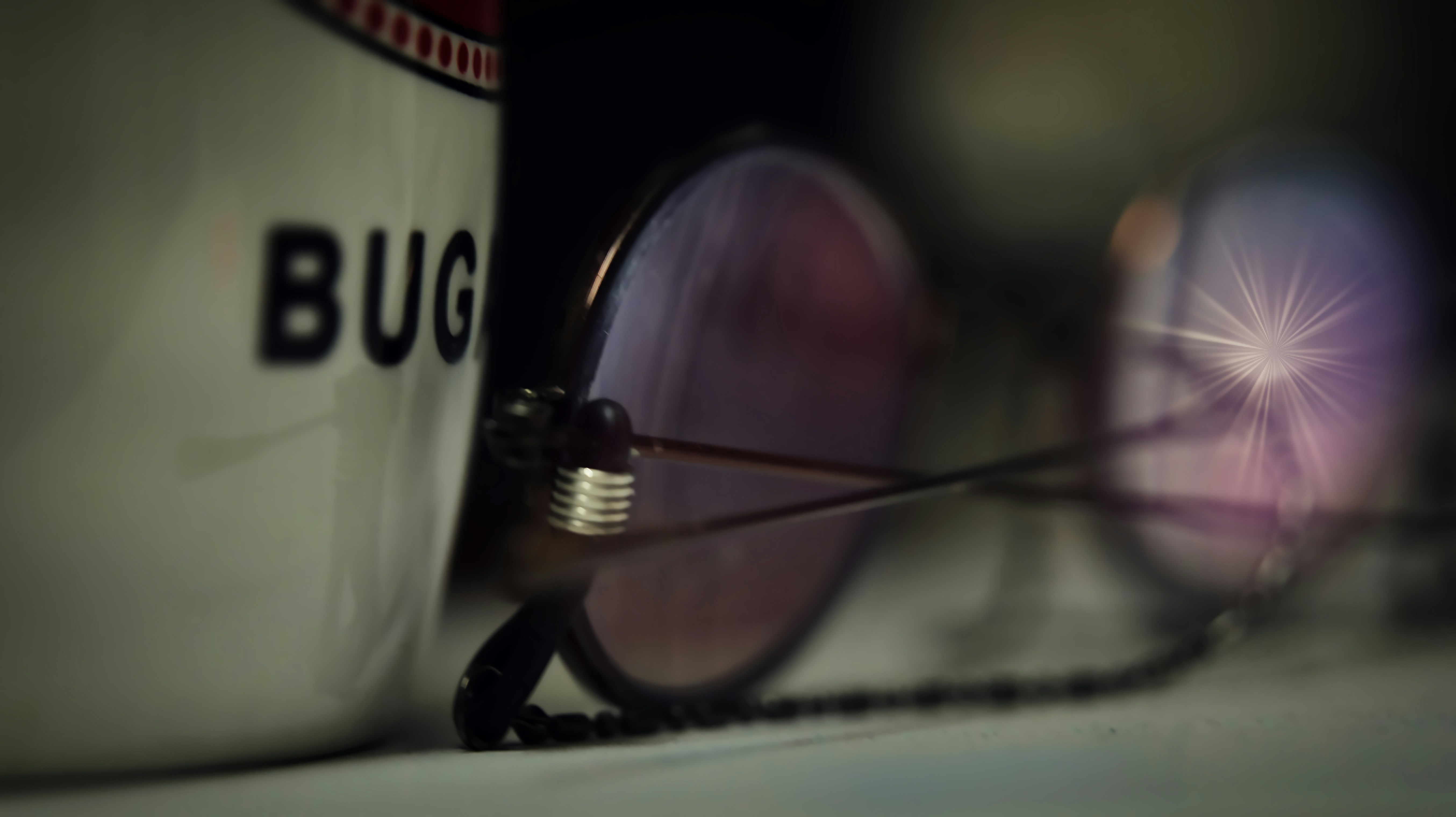 Bug Mug and Neon Bokeh: A Quiet Desk Close-Up