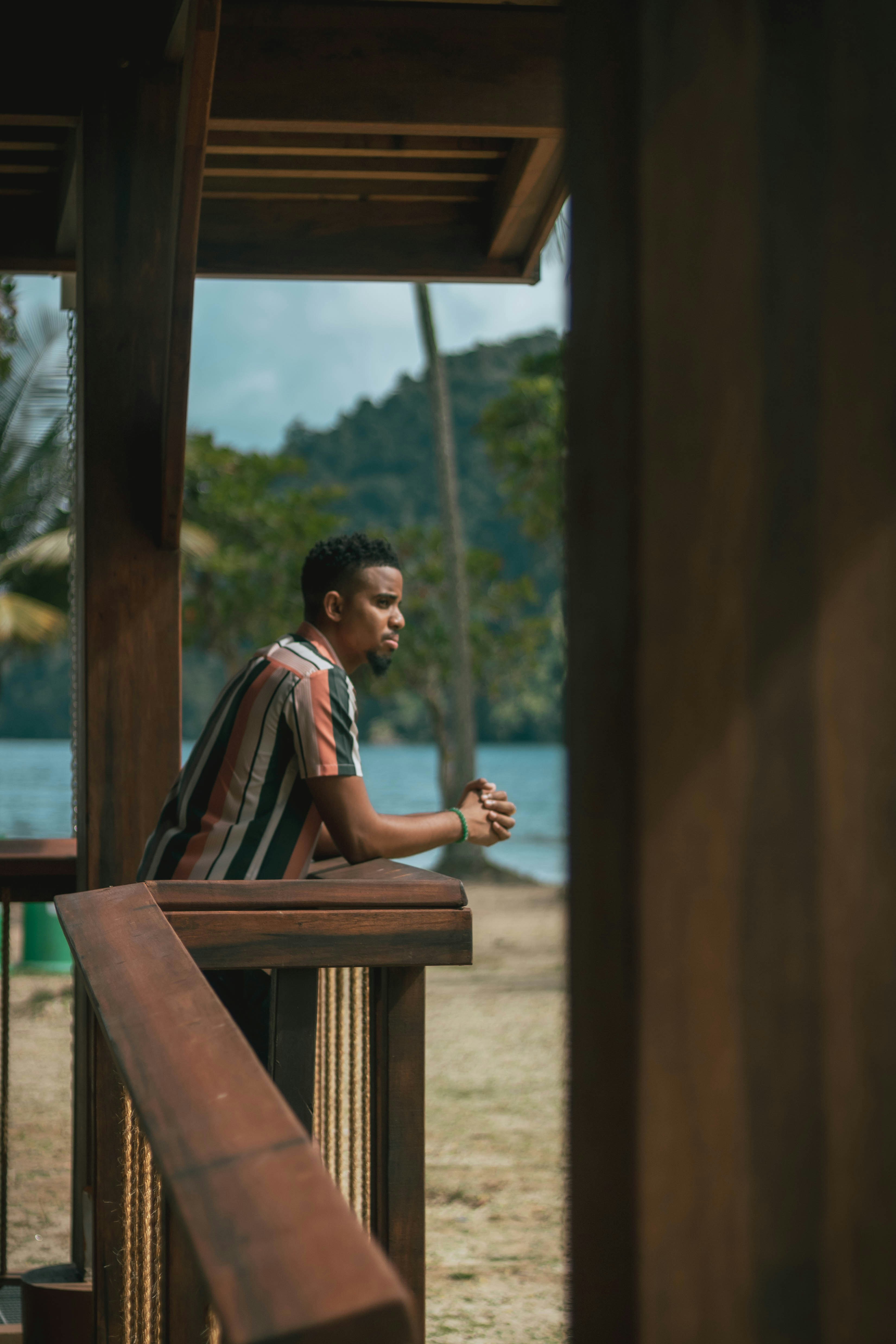 Contemplative Profile on a Beachfront Veranda