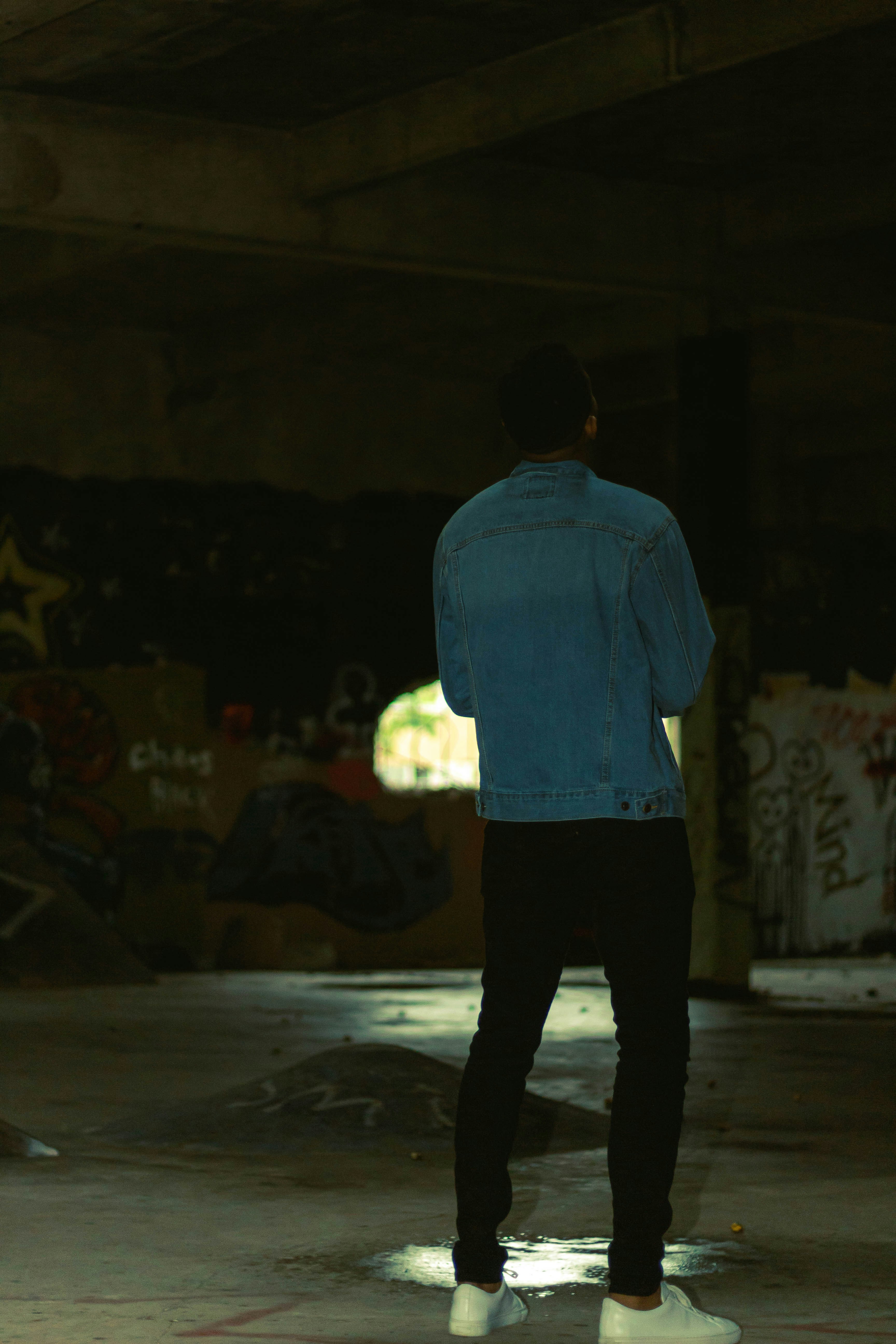 Denim Back to the Light: A Portrait in a Graffiti Underpass