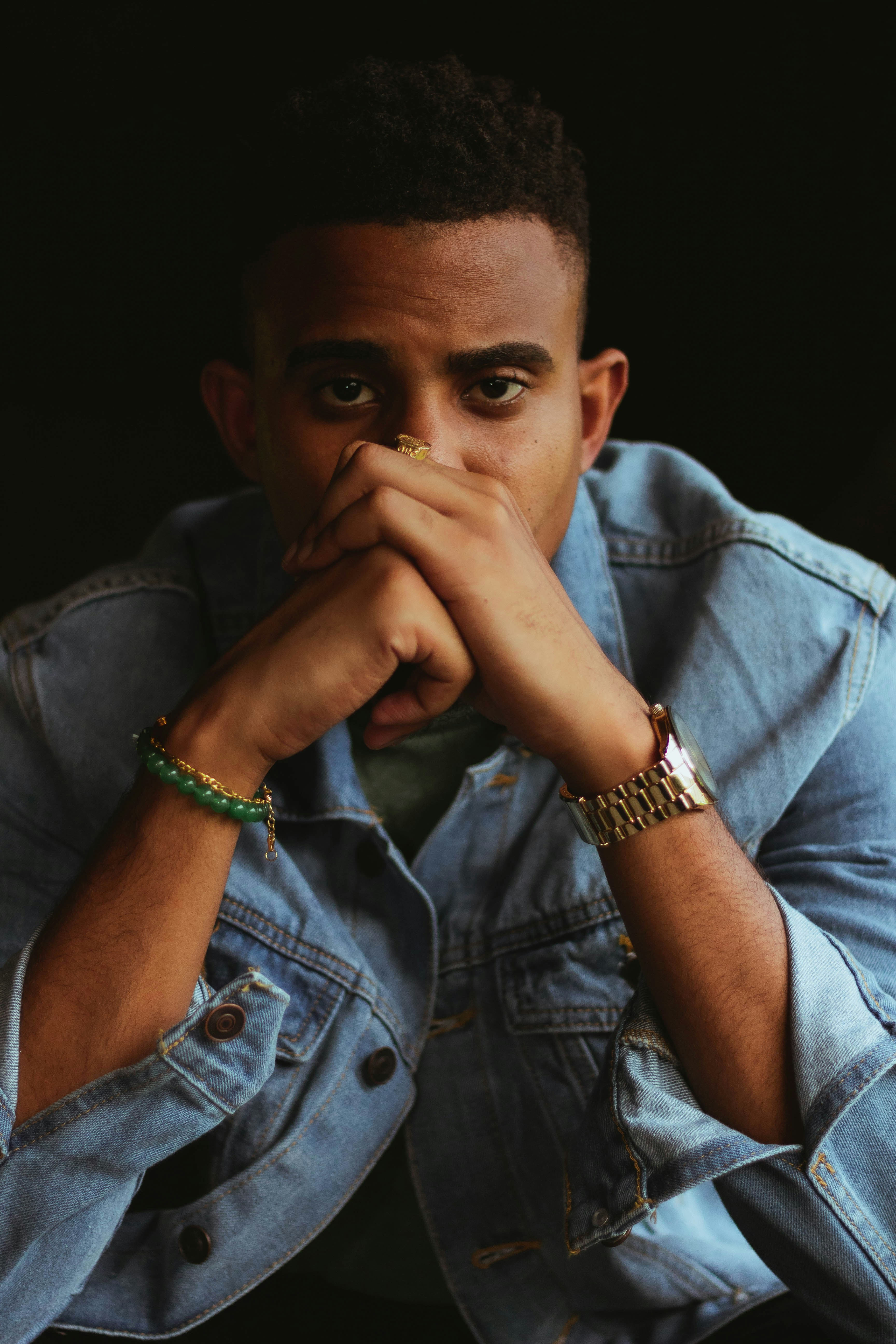 A man with his hands on his face photo – Free Natural light Image on ...