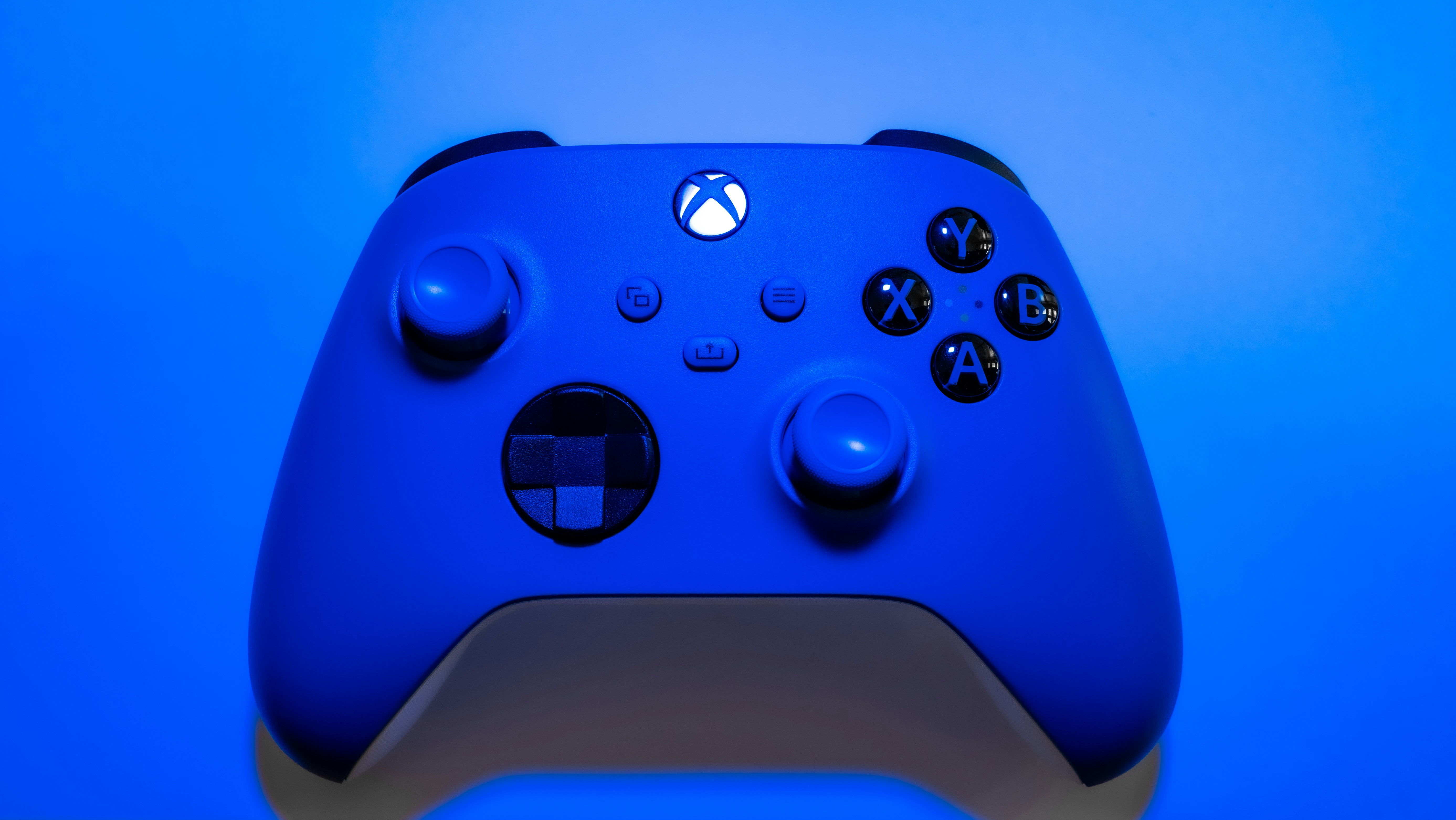 A close up of a blue video game controller photo – Free Xbox Image on ...