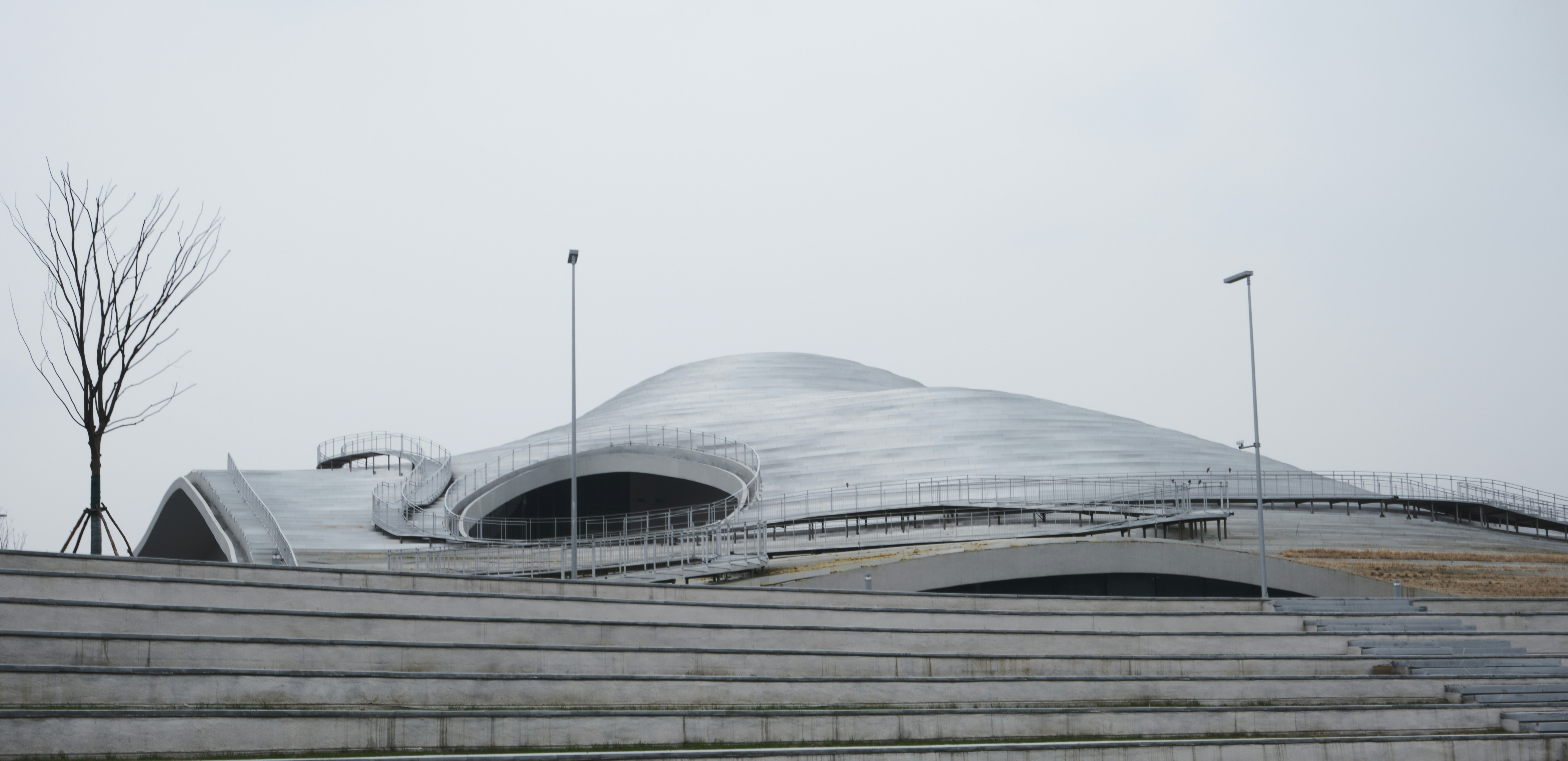 A very large building with some stairs in front of it photo – Free ...