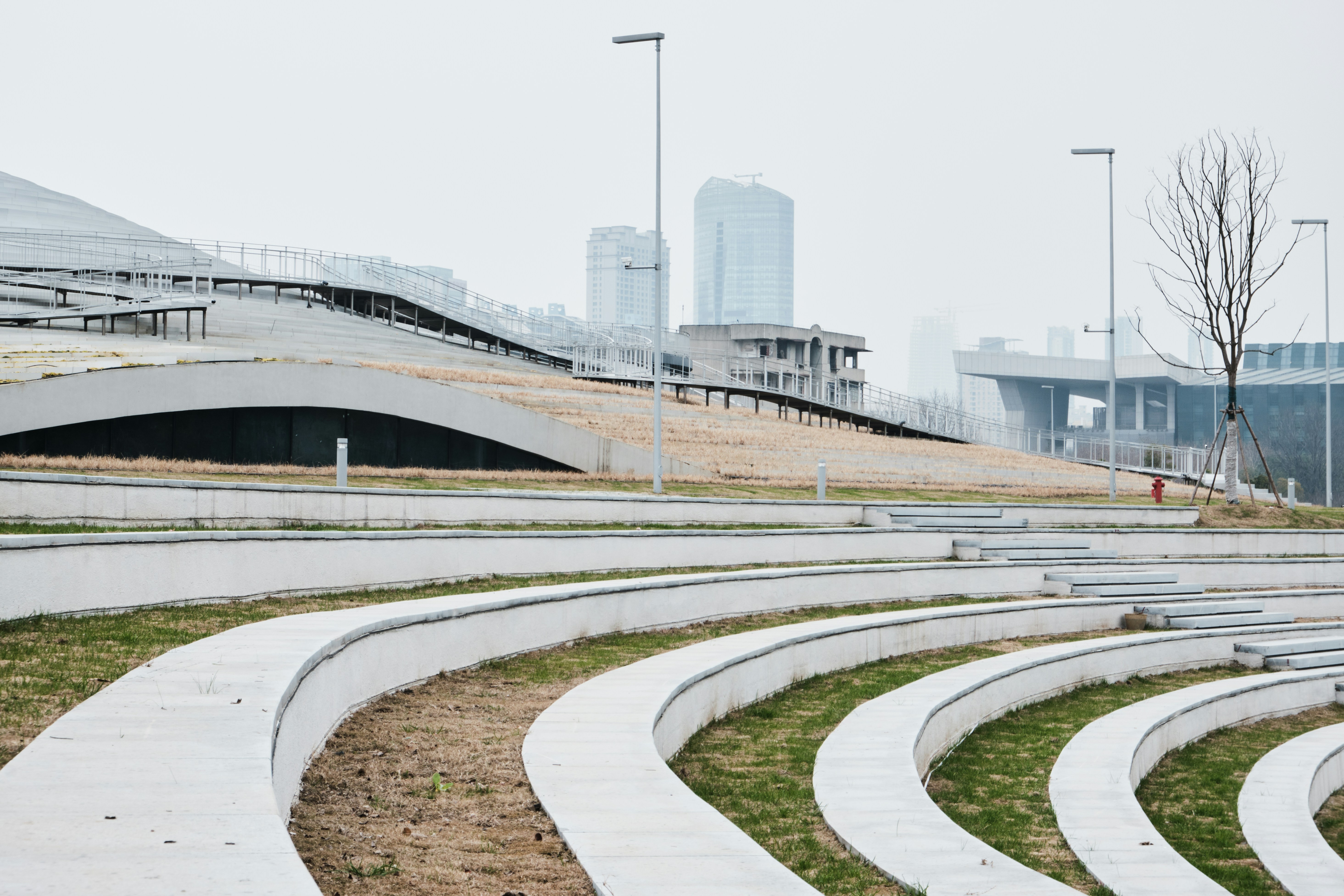 A large concrete structure with steps in front of it photo – Free ...