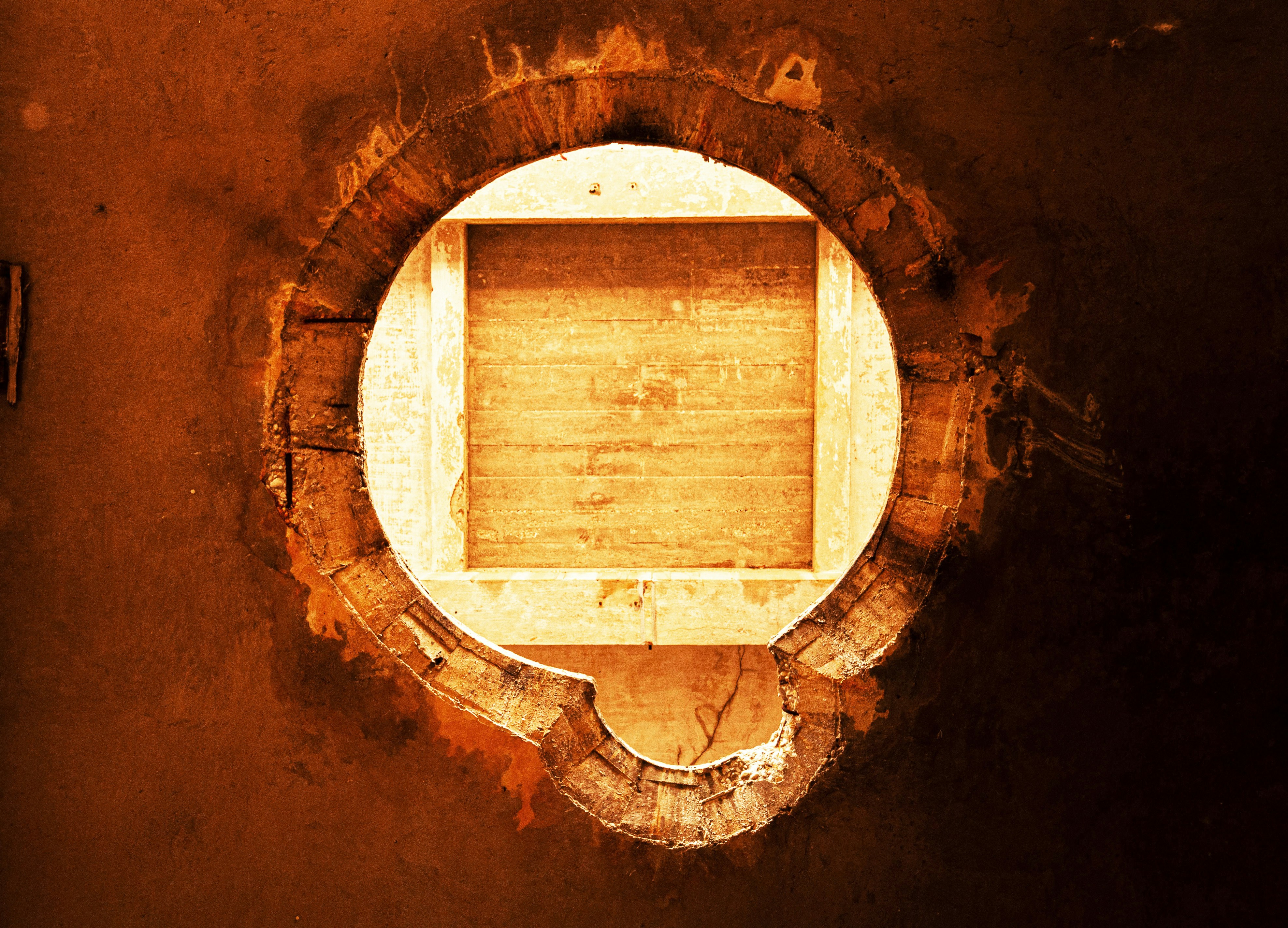 Oculus in Brick: A Circular Frame Harboring a Sunlit Square