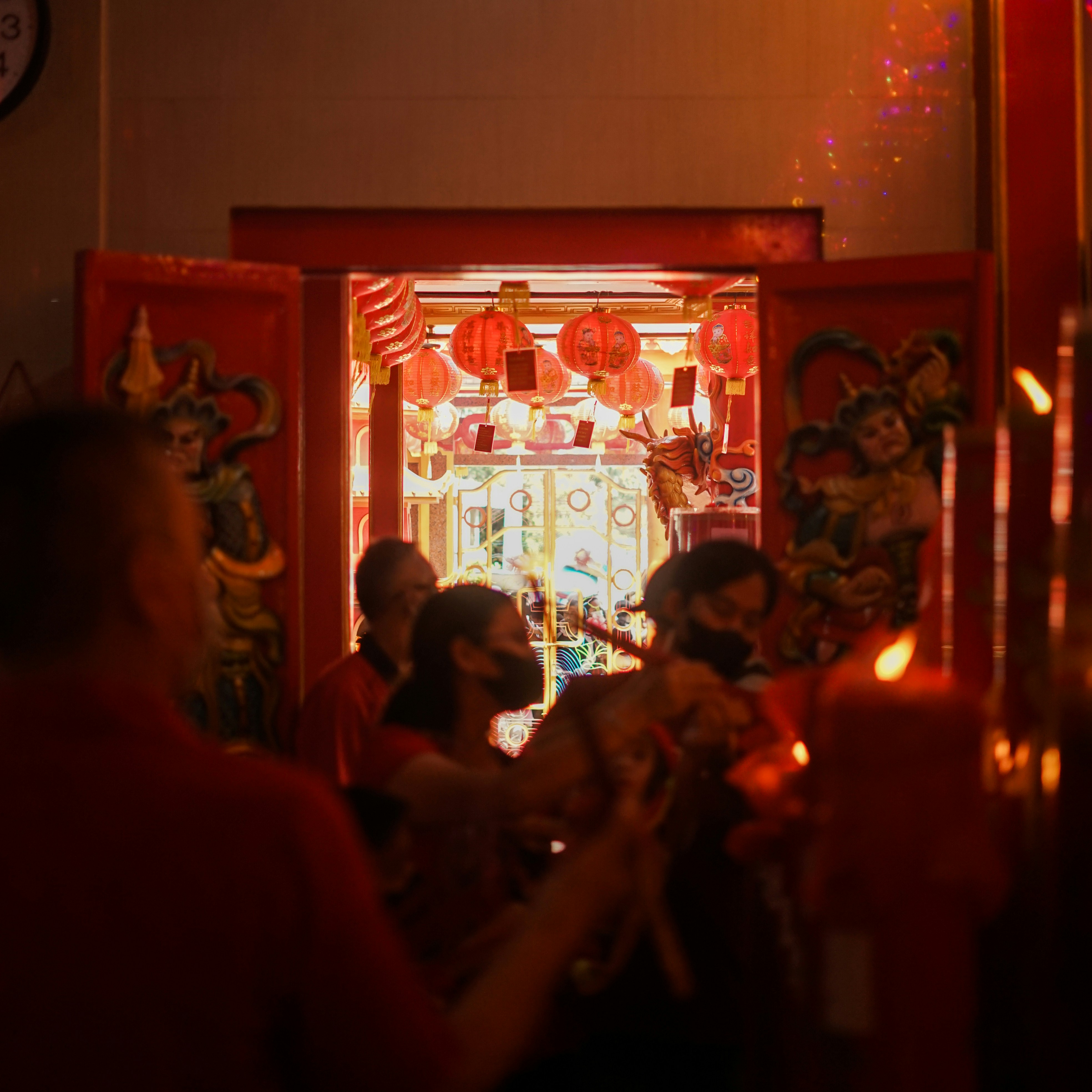 Lantern Corridor at Dusk: Firelight Through a Festival Doorway